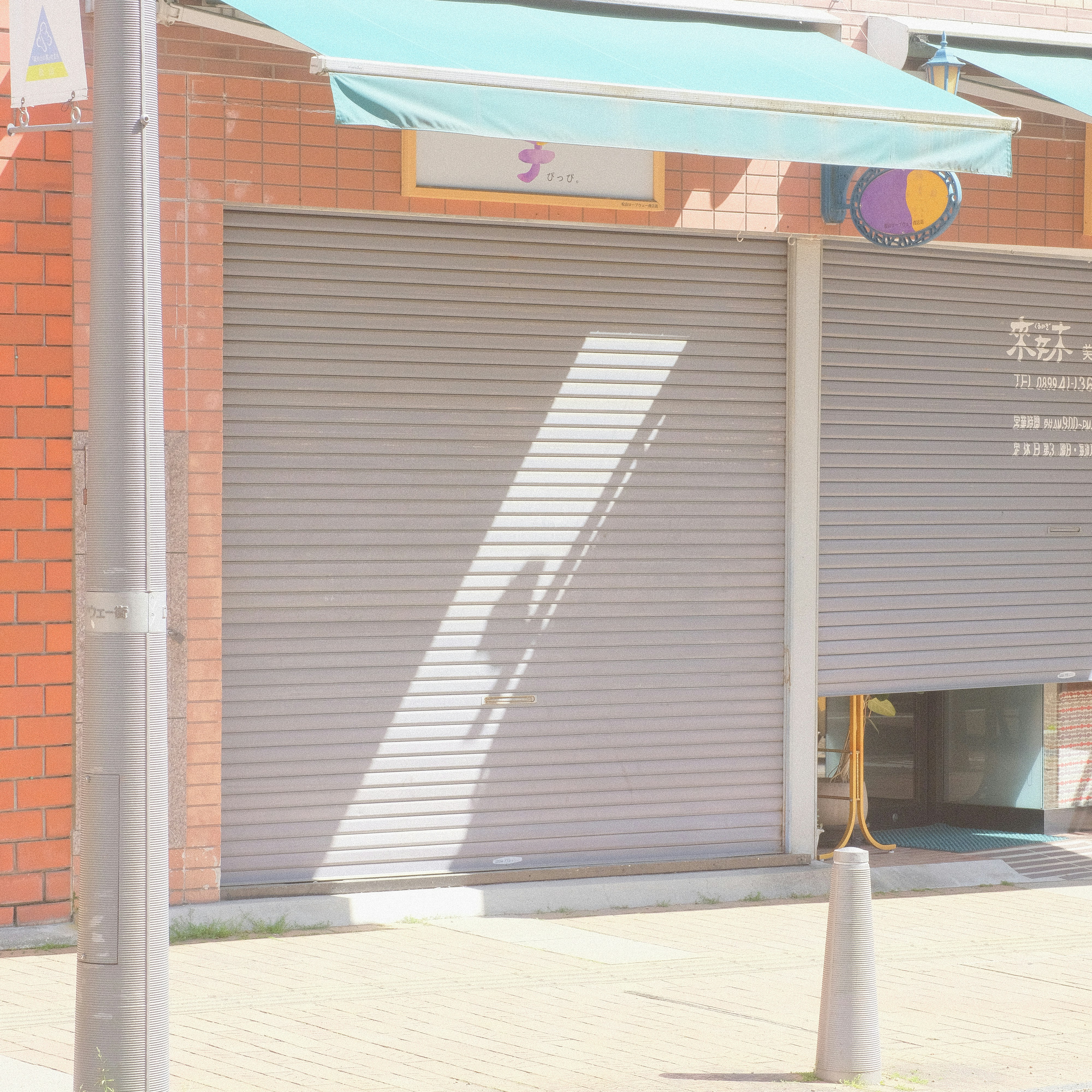 Shadowed Rollup Door with Subtle Afternoon Light Casting a Diagonal Stripe