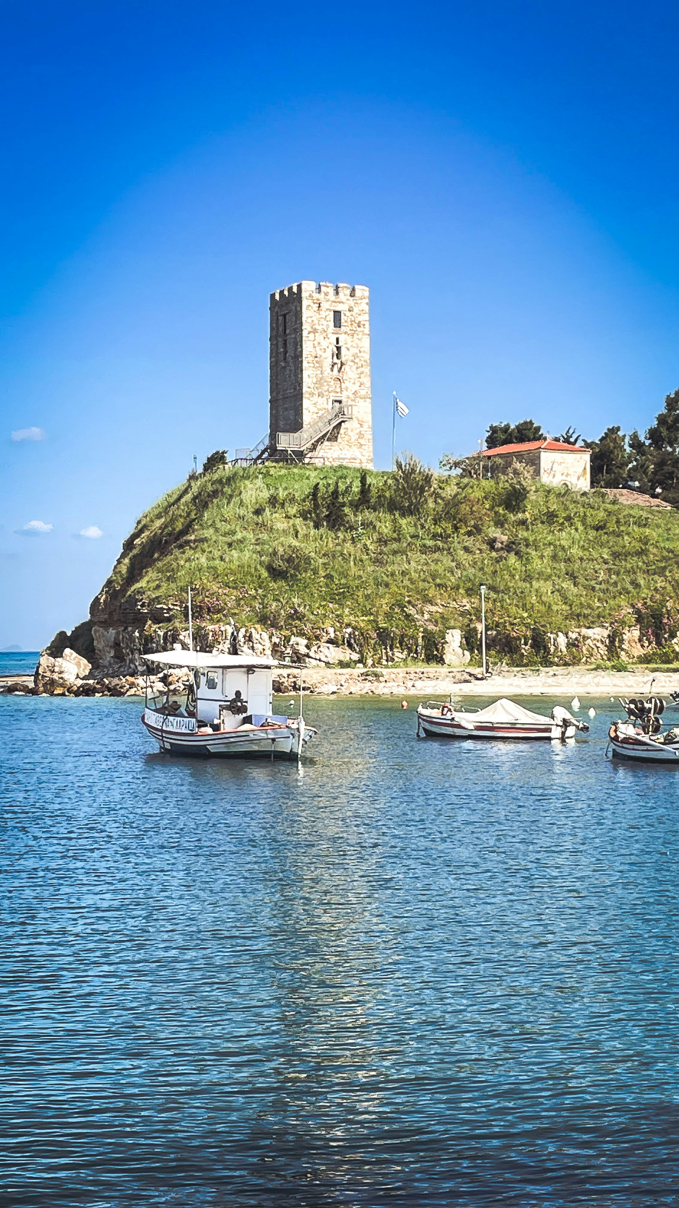 Hilltop Watchtower Over Calm Harbor