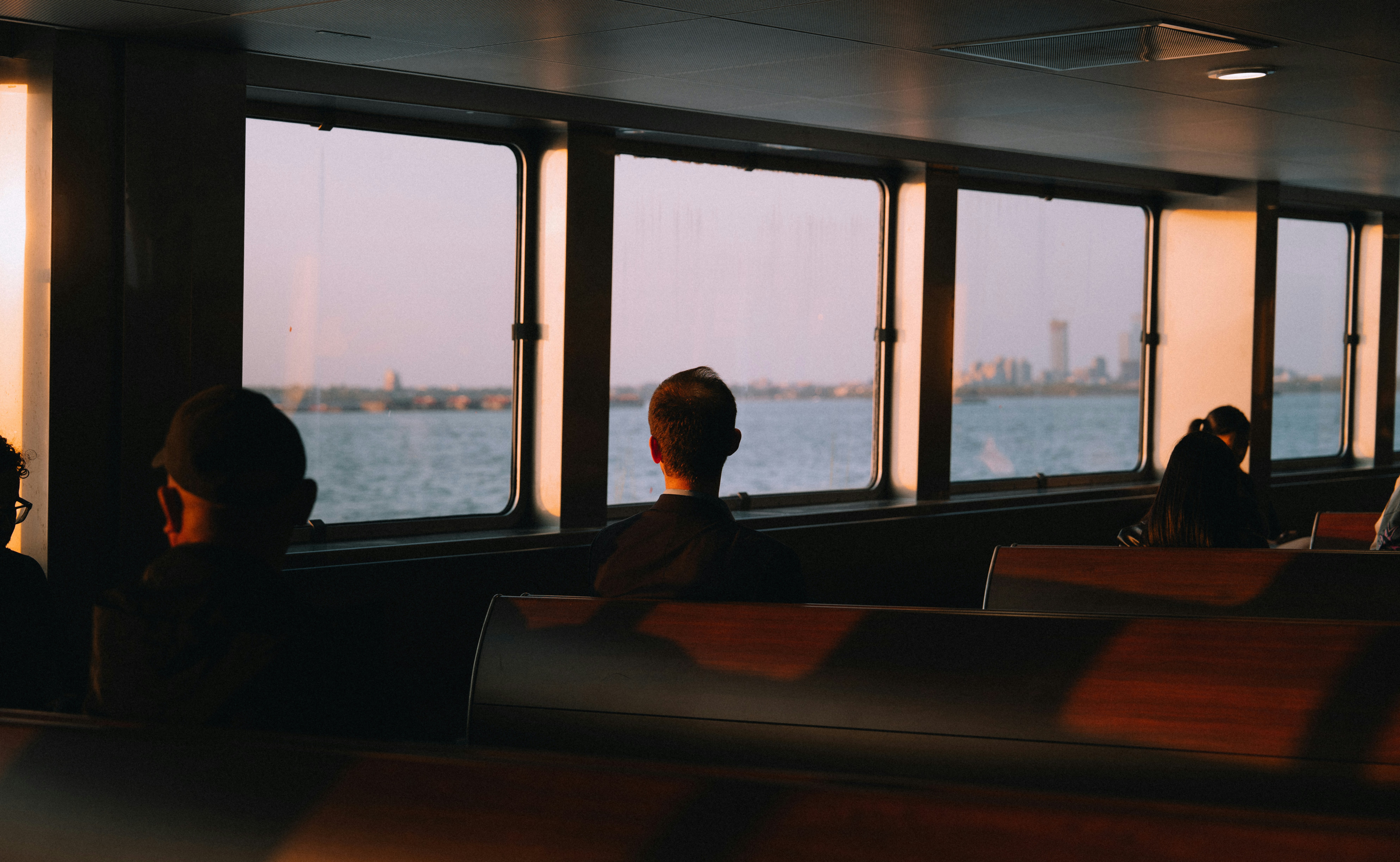 Windows to the Water: Quiet Voyage at Dusk