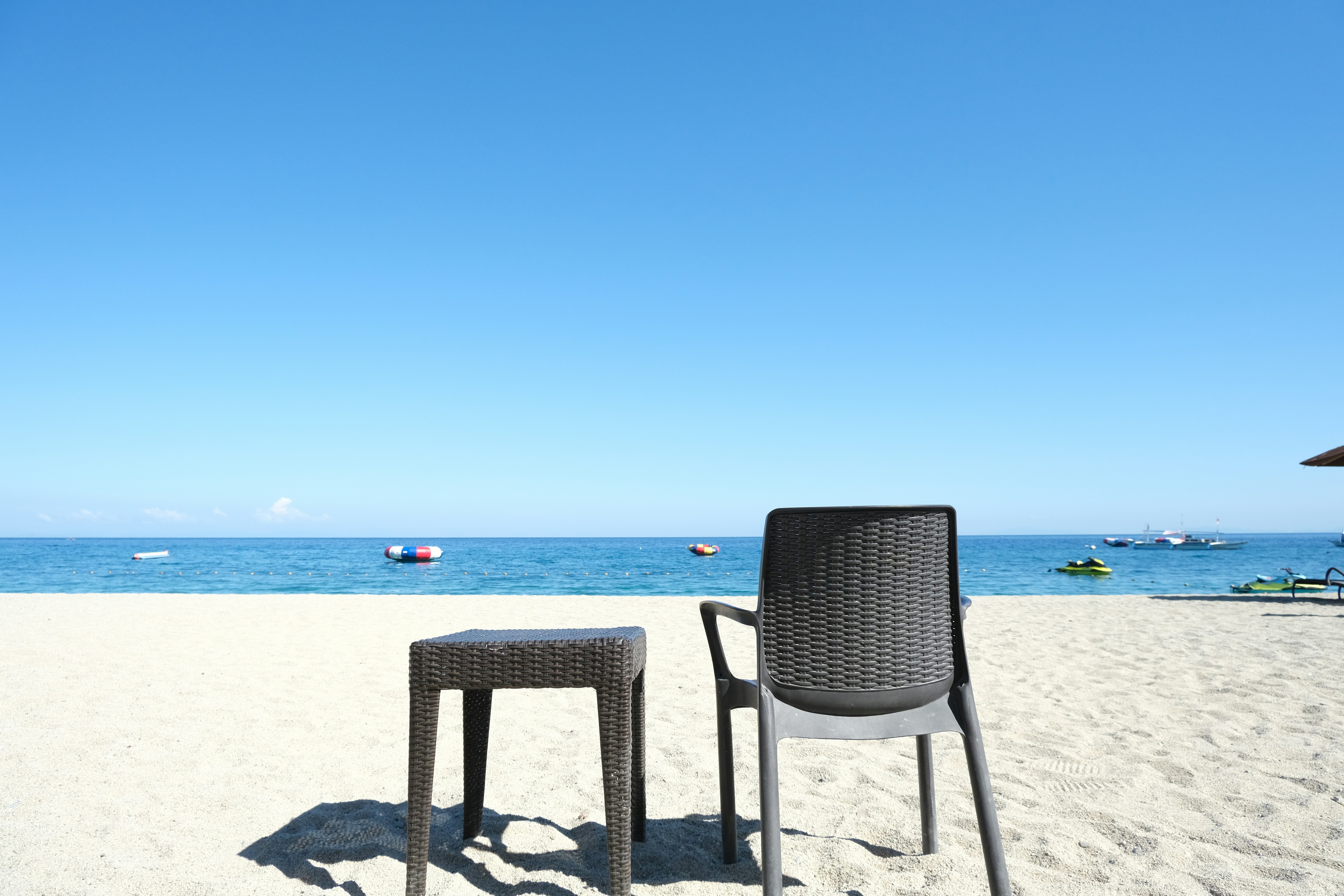 Two Beach Chairs Stand Guard Over a Quiet Sea