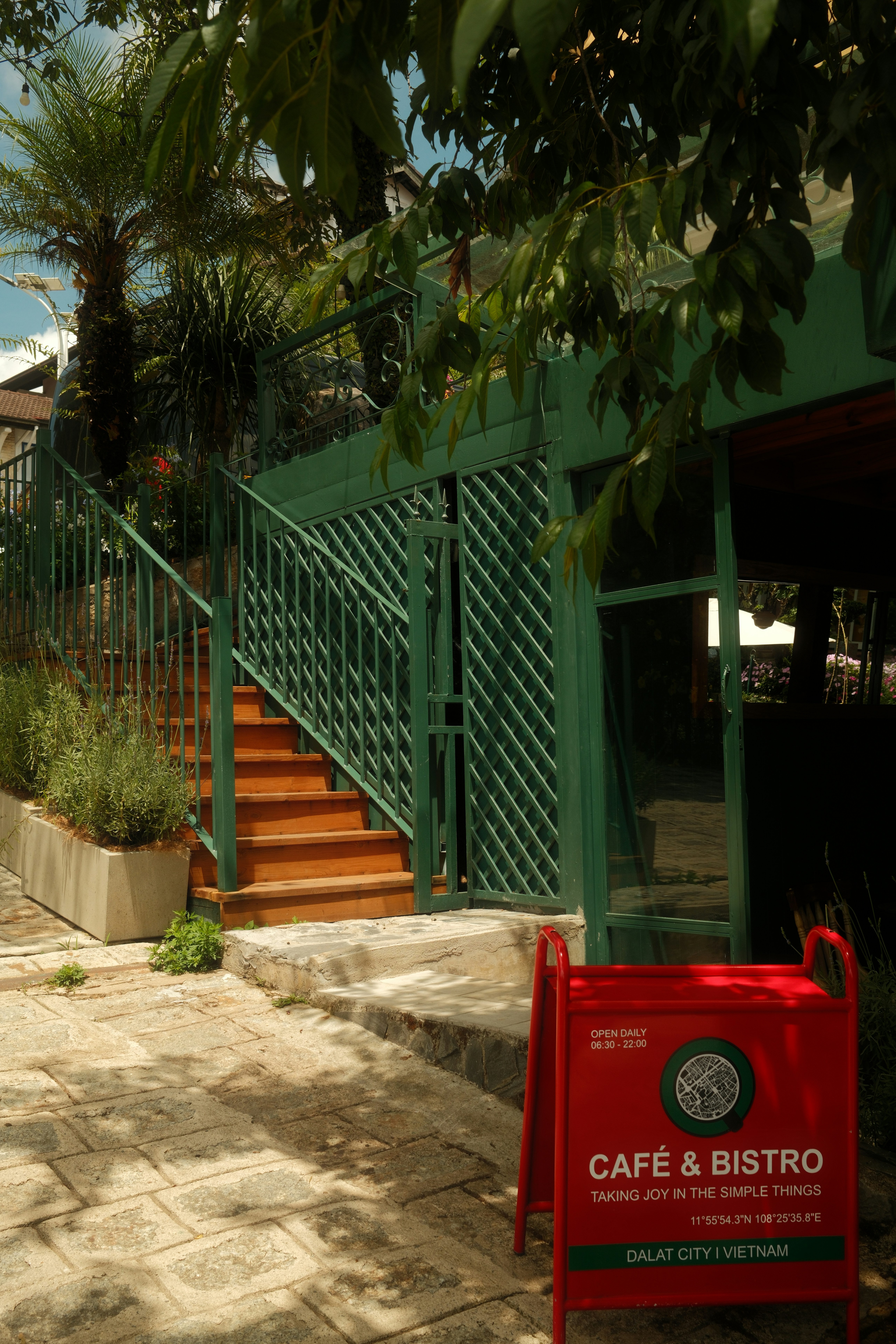 Green Staircase to a Cozy Café