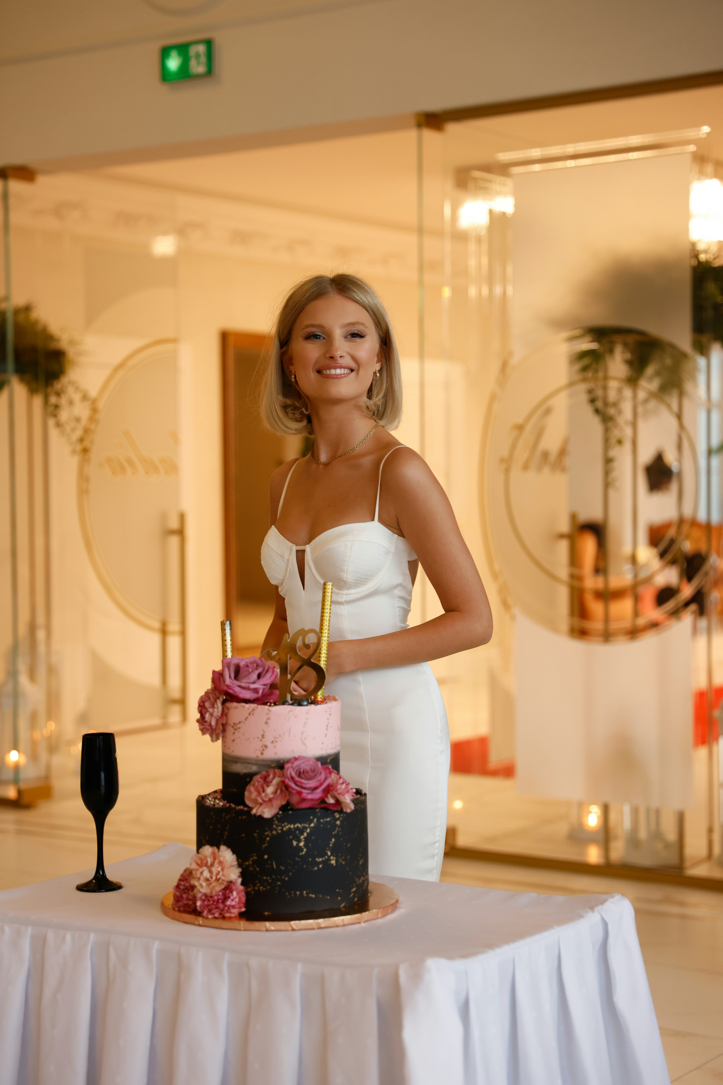 Elegant Birthday Moment: A Cake, A Smile, and Soft Party Light