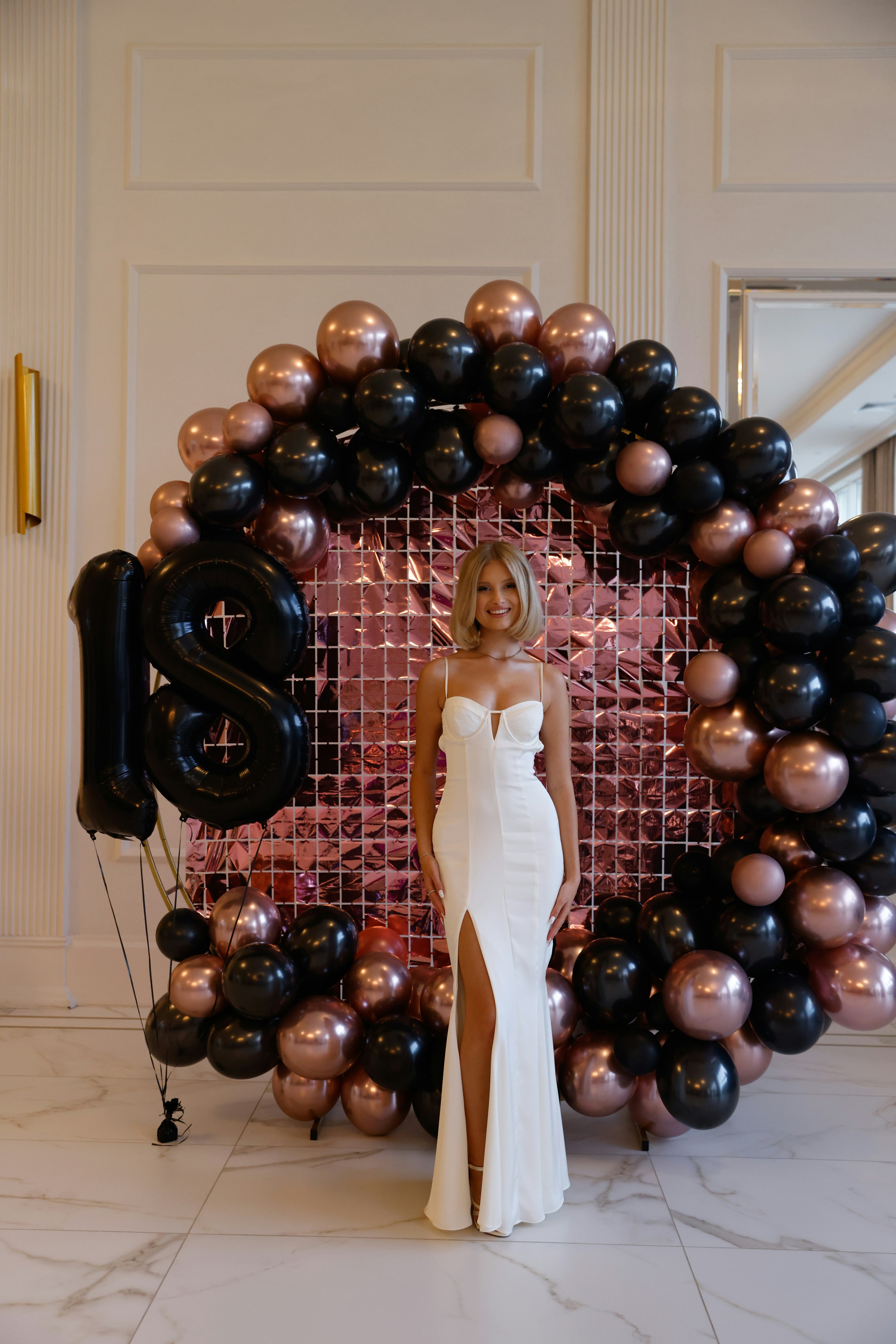 Glamorous Birthday Portrait Amid a Balloon Arch