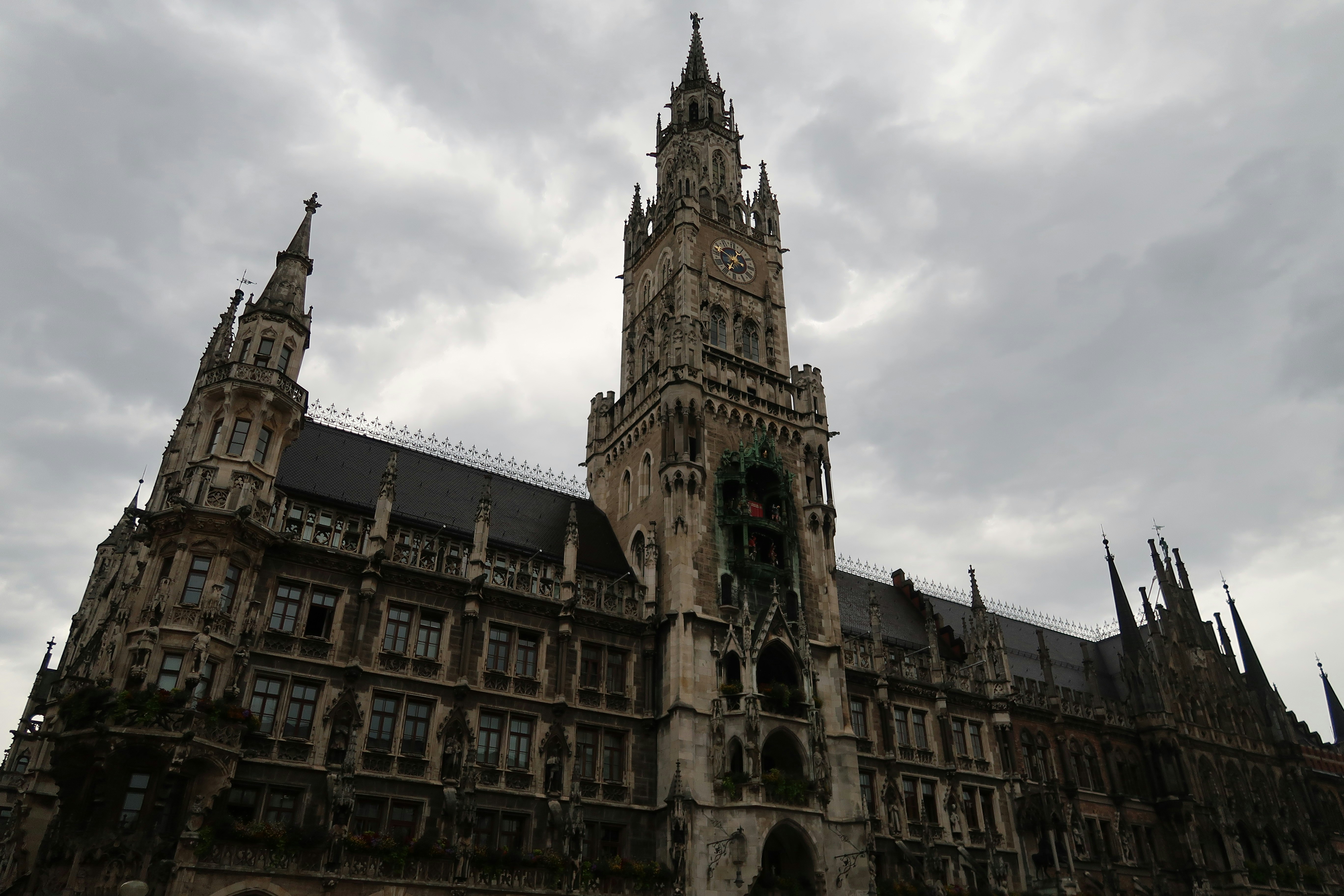 Gothic City Hall Rising Under Clouded Skies