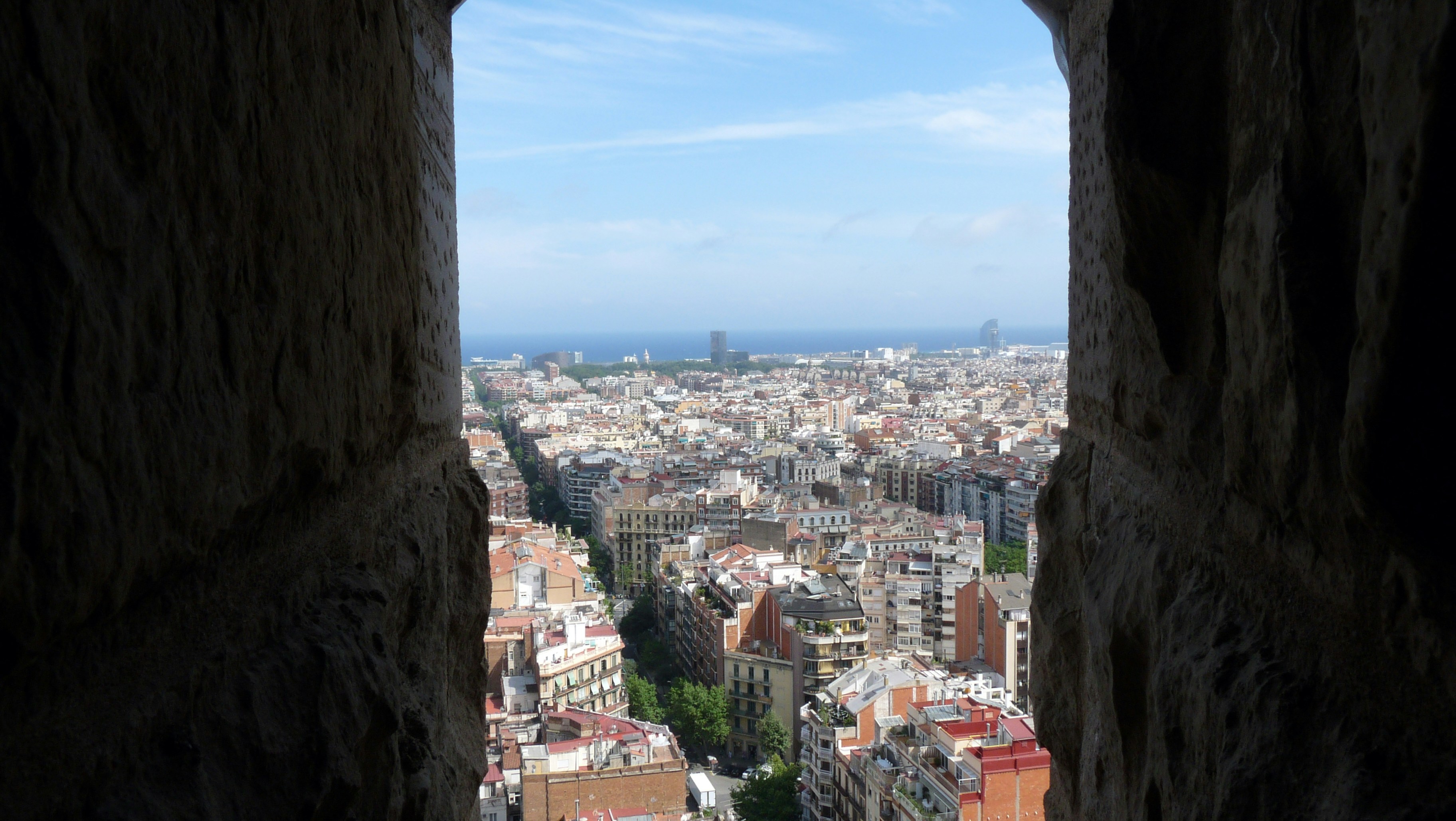 City Framed by a Stone Window