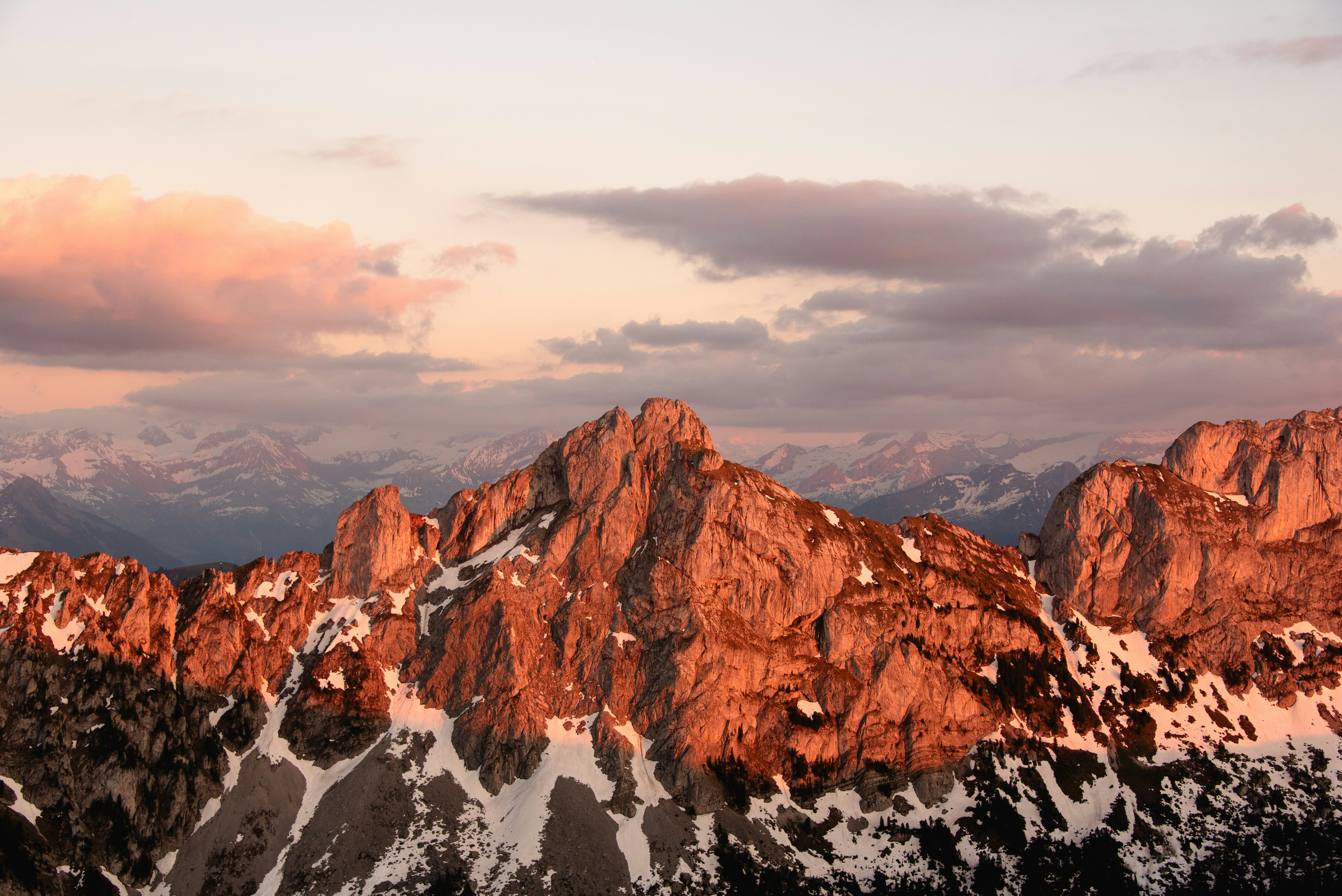 Sunlit Crest: Alpine Peaks Brought to Life at Dusk