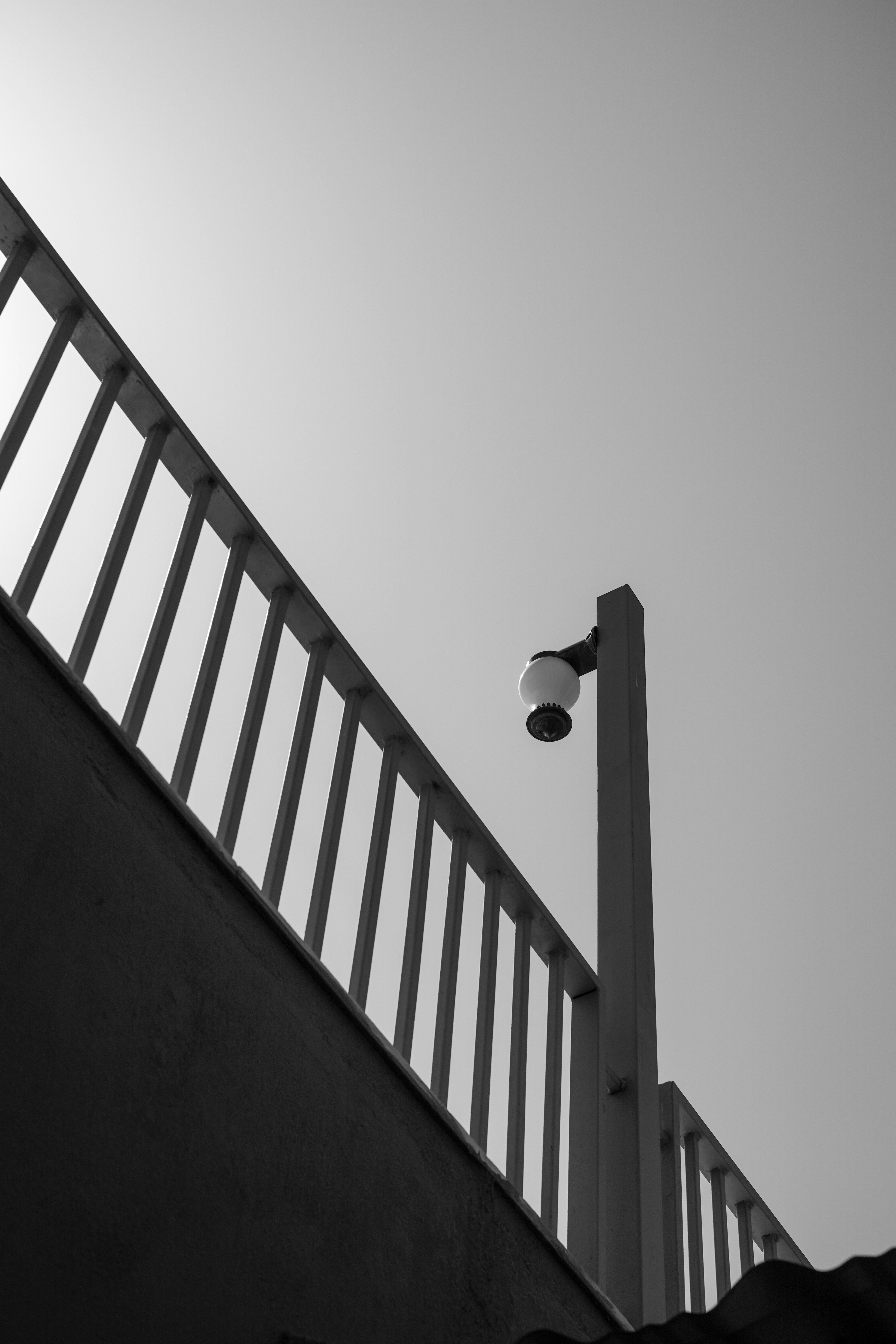 Concrete Balcony Line and Lamp Post Against Sky