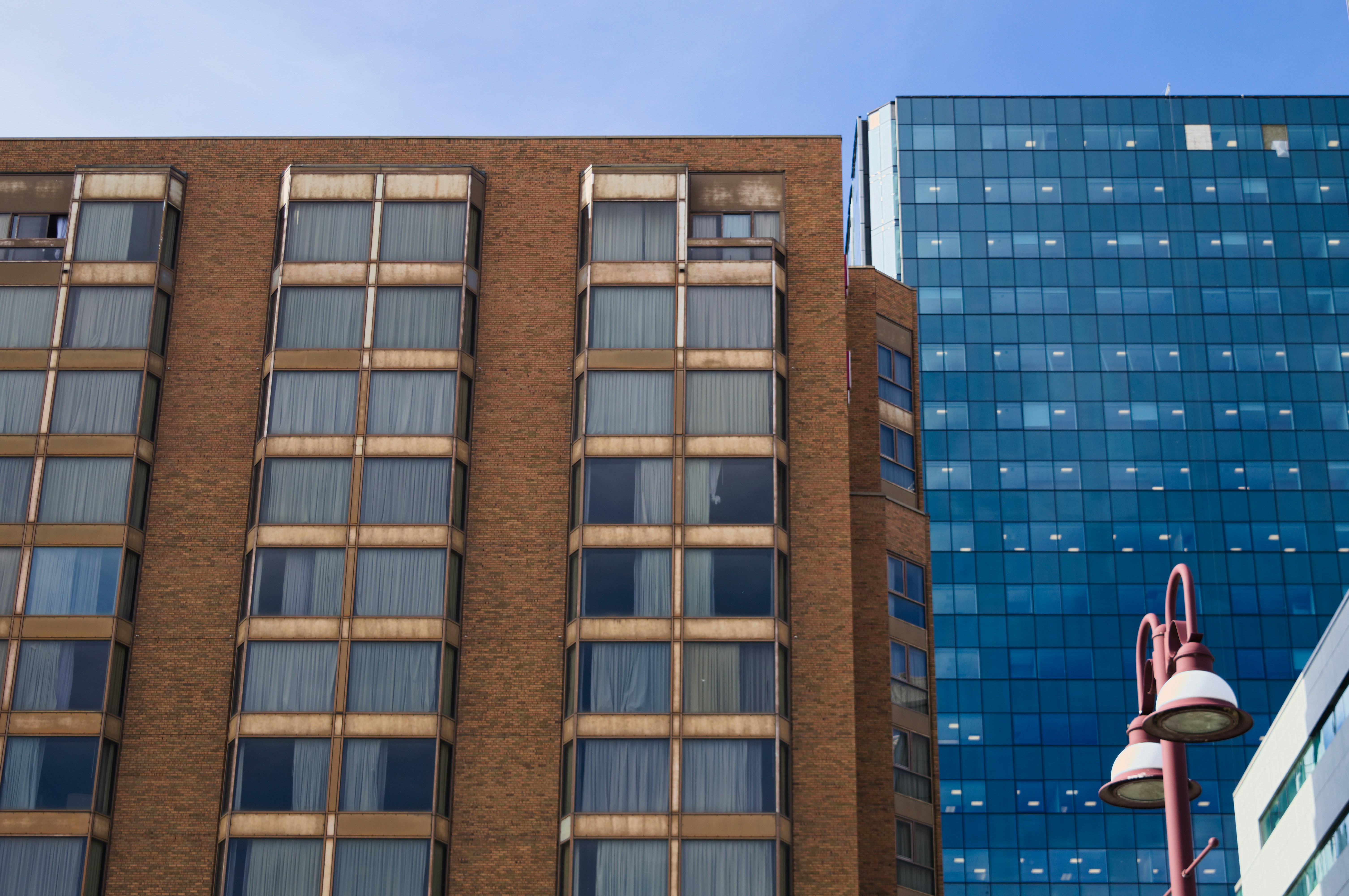 Glass and Brick Confluence: A Cityscape Meet-Cusion Between Facades