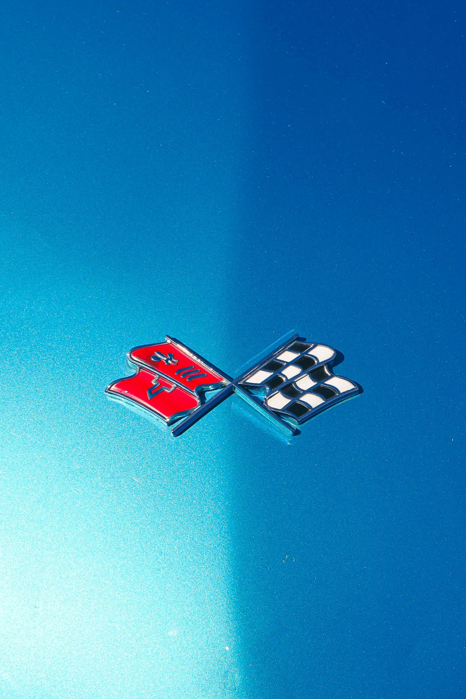 Blue Crest: The Corvette Emblem in Quiet Night Shine