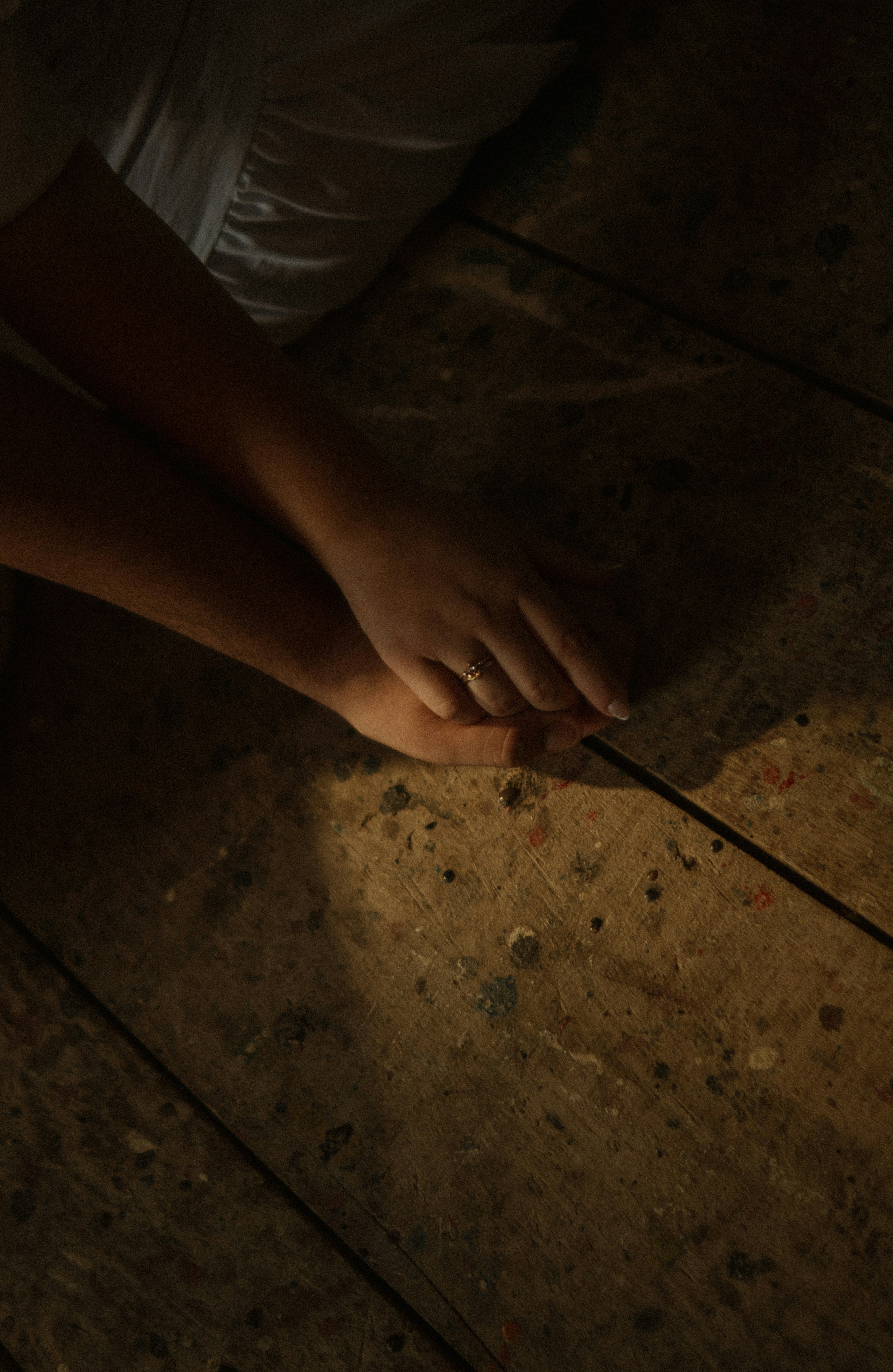 Quiet Hands on Weathered Wood