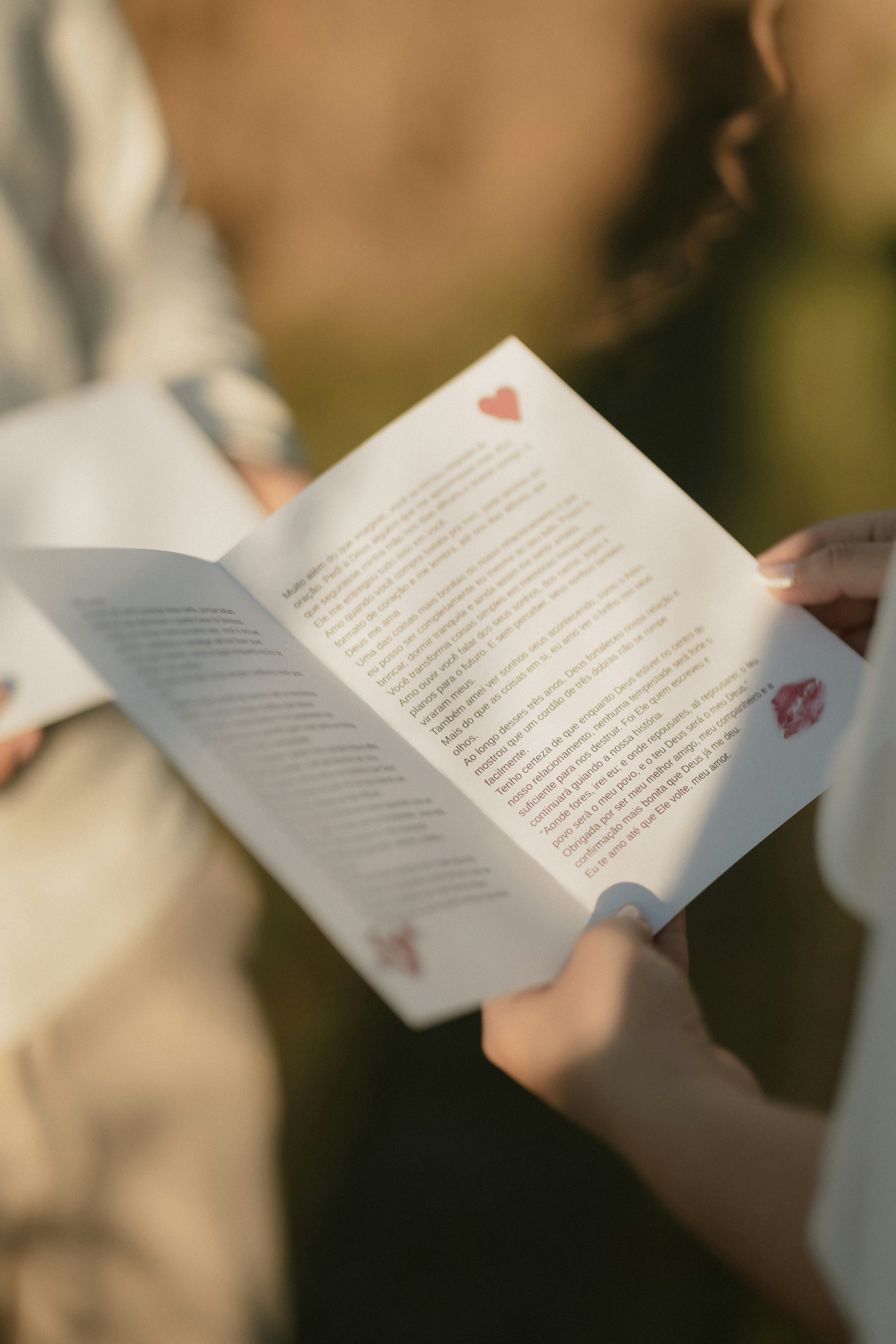 A Quiet Moment: Reading a Card Amid Warm Evening Light