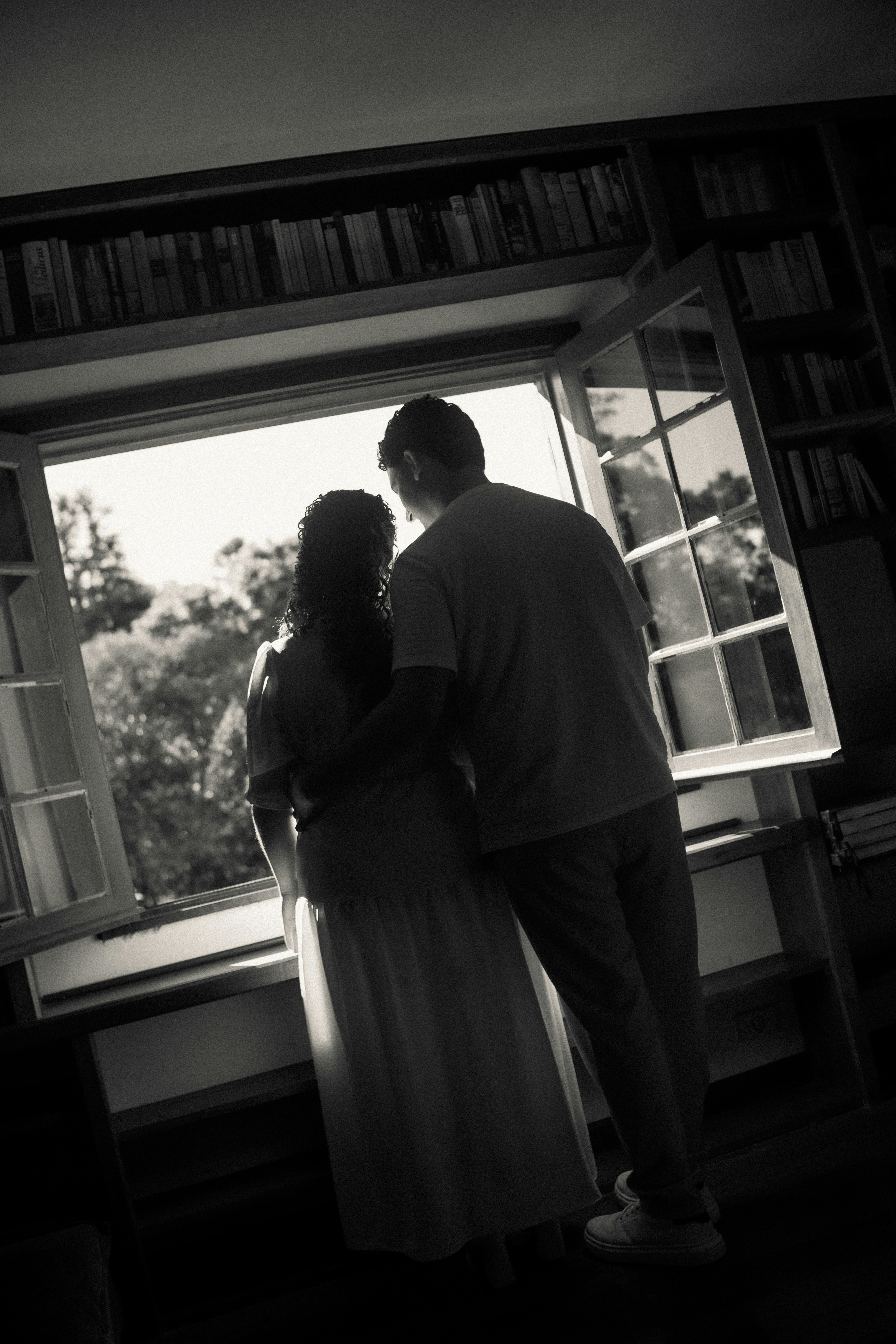 Quiet Embrace at the Open Window