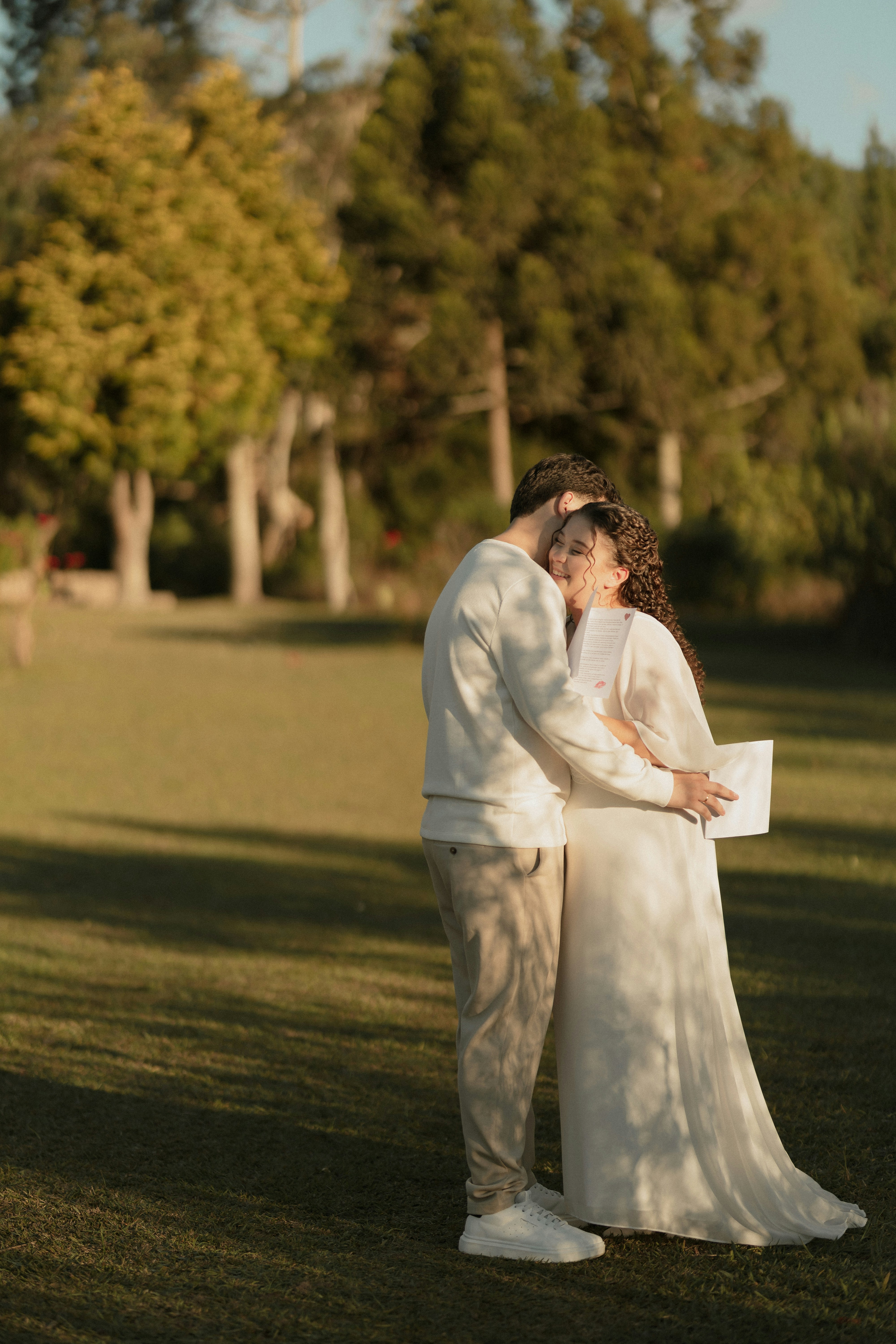 Warm embrace in a sunlit park
