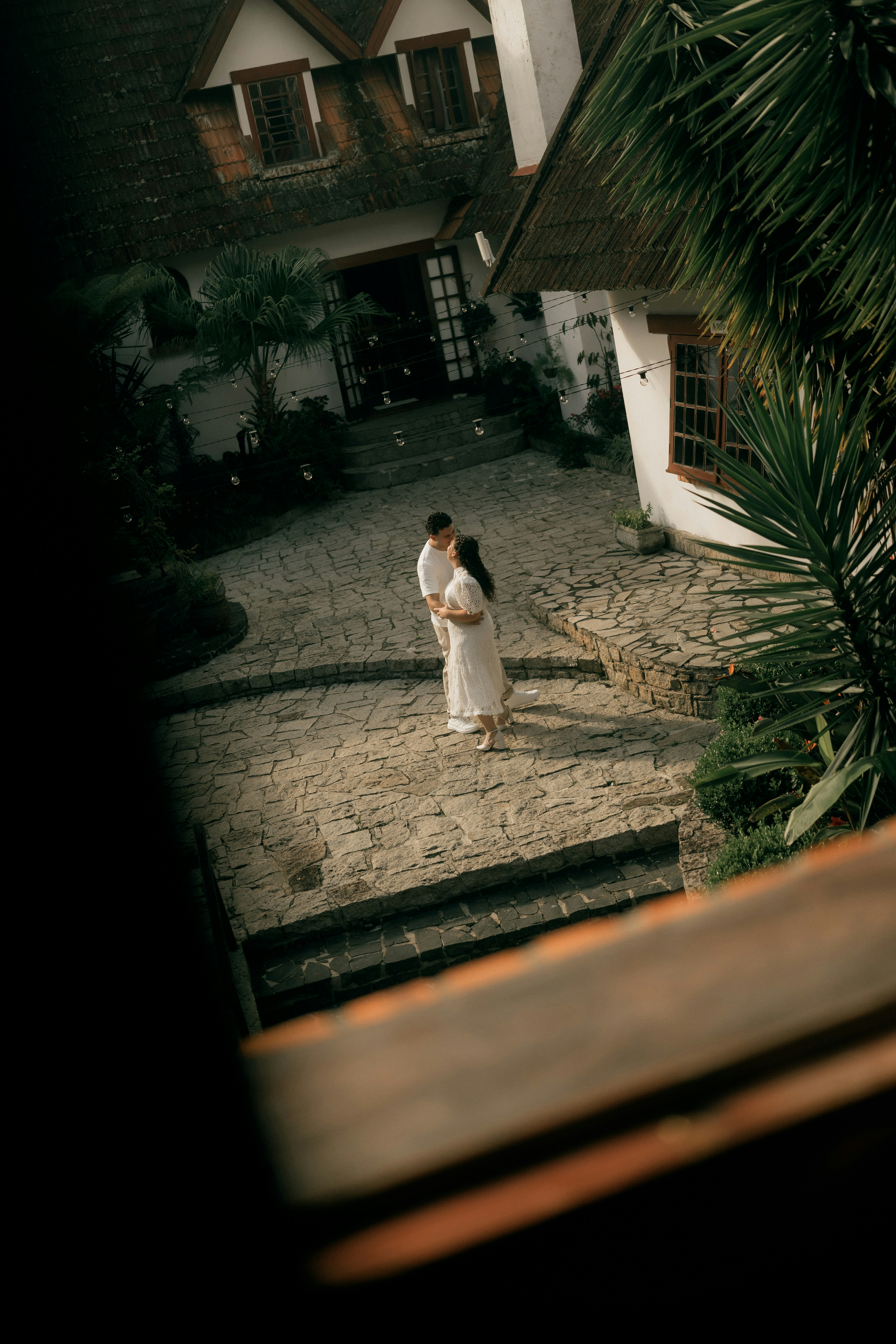 Whispered Vows on a Sunlit Courtyard