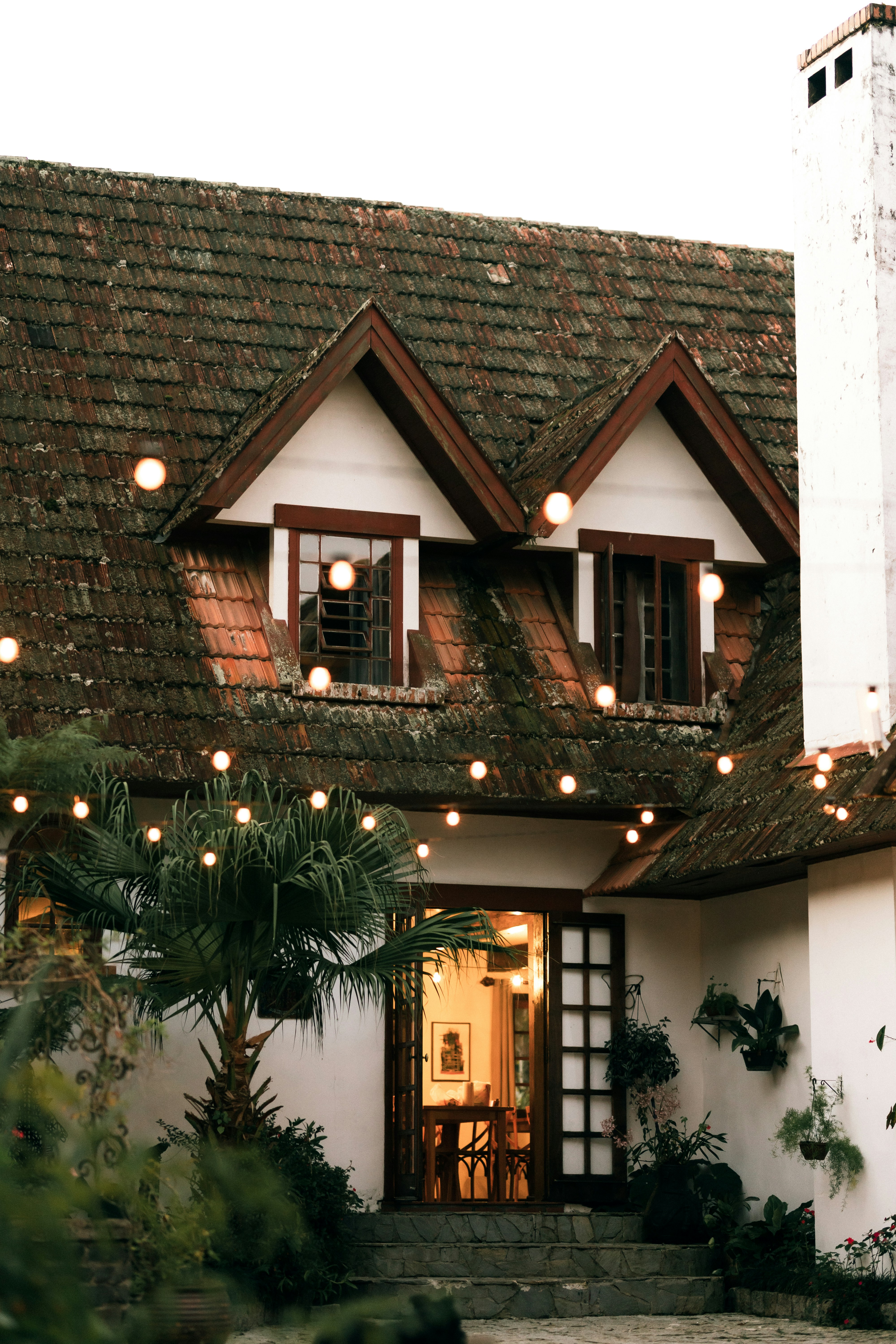 Warm Evening at the Cottage: String Lights and Open Doorways