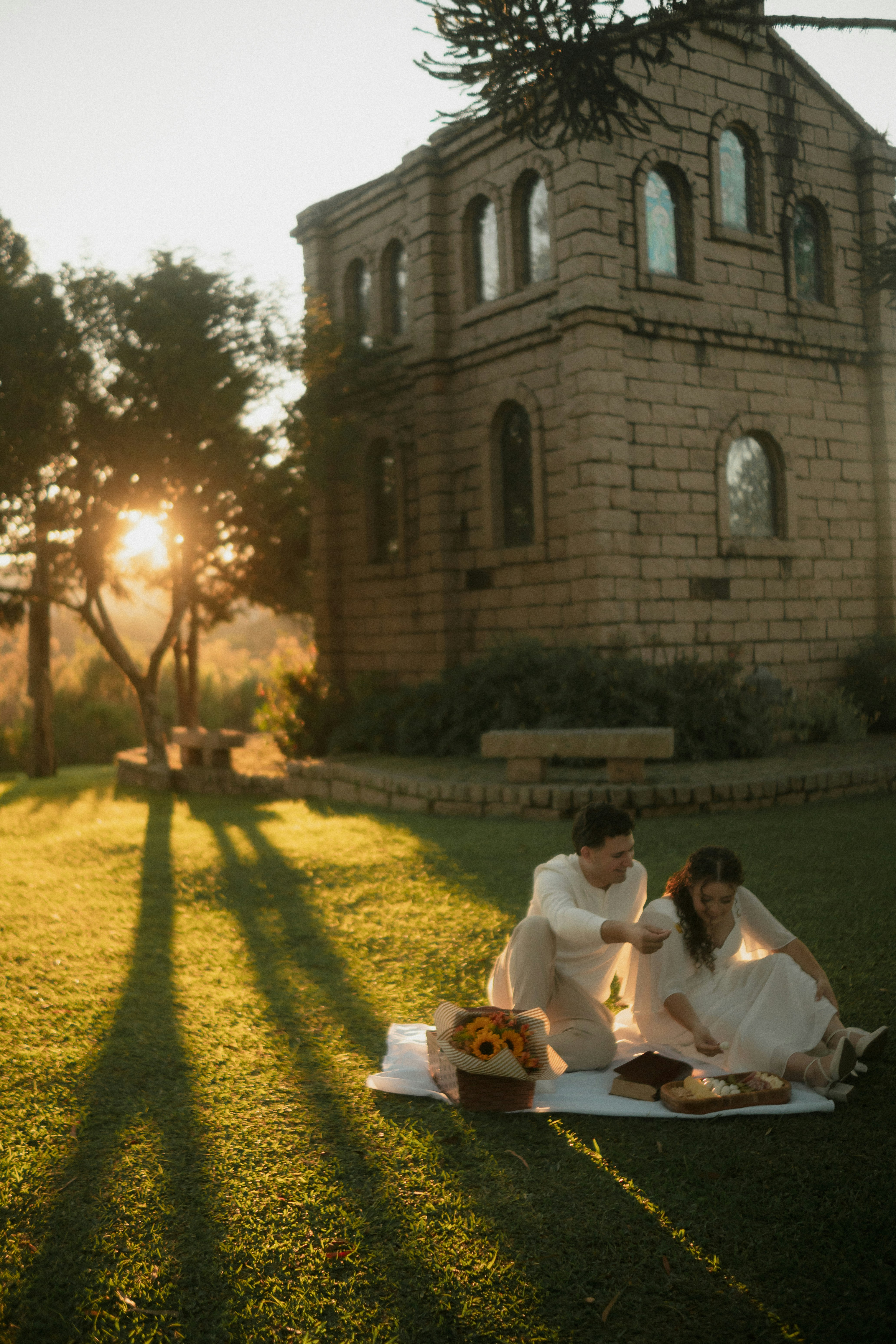 Sunlit Picnic by the Stone Church at Golden Hour
