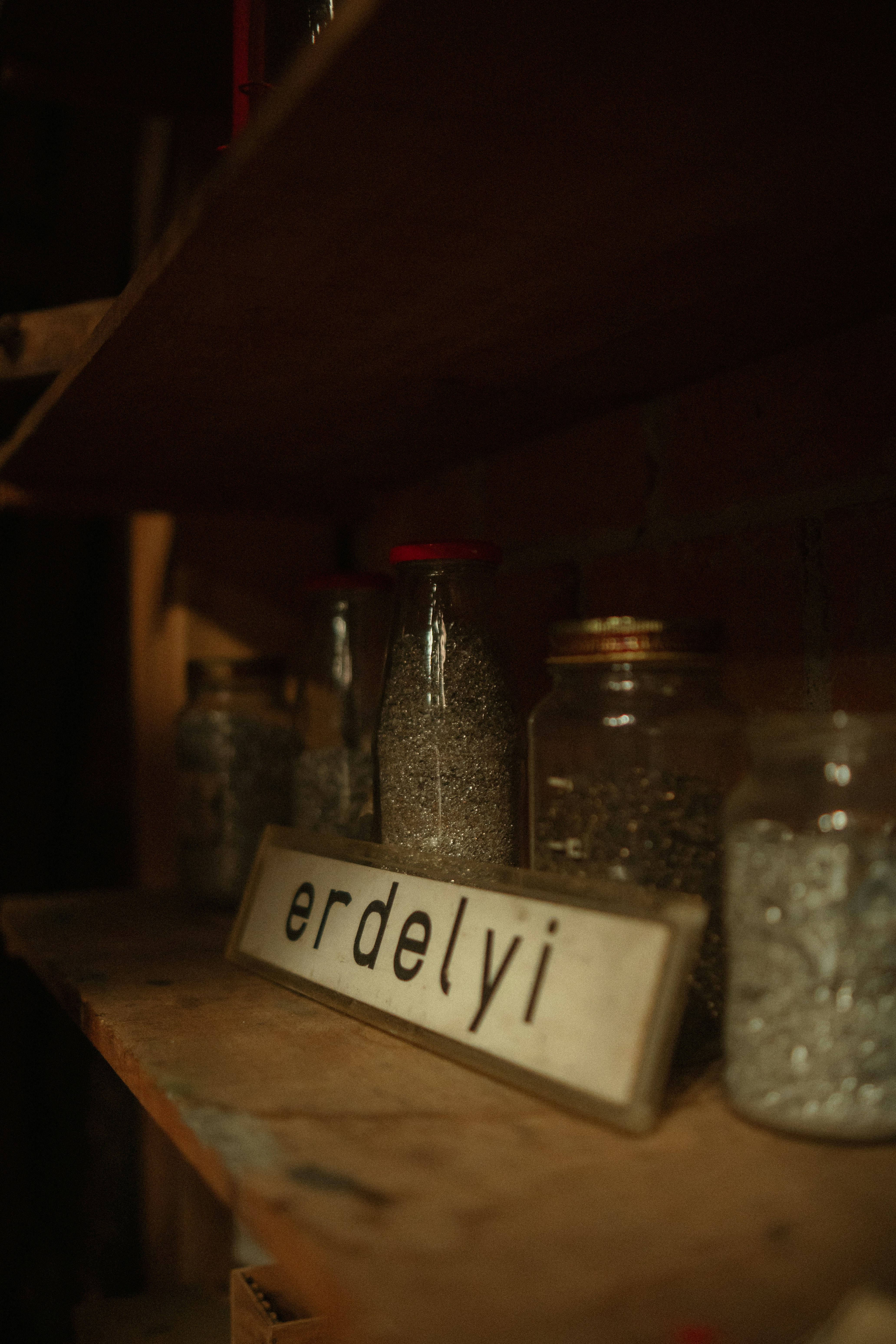 Dusty Shelf, Quiet Signage: A Corner of a Vintage Pantry