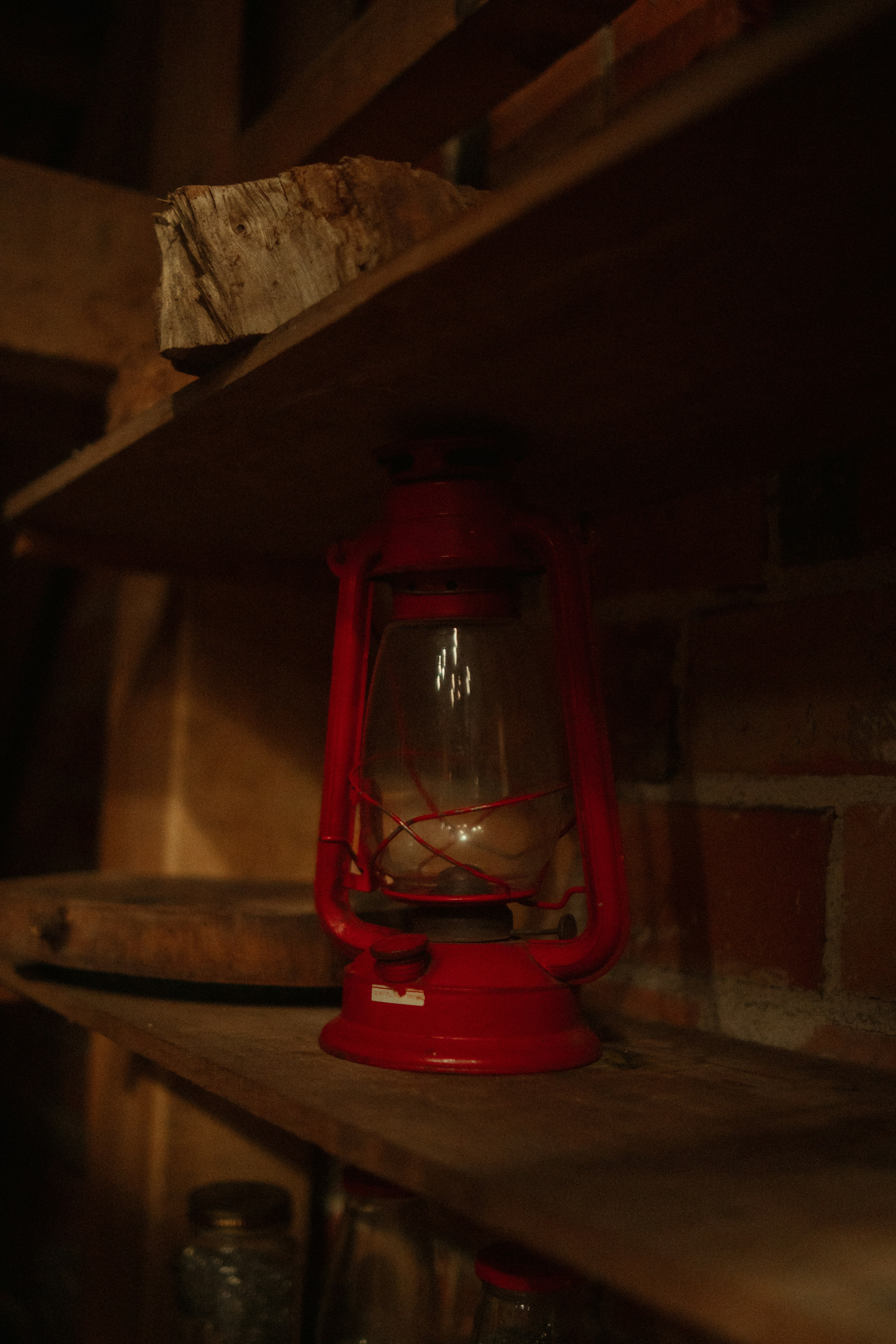 Red Lantern in a Shadowed Workshop