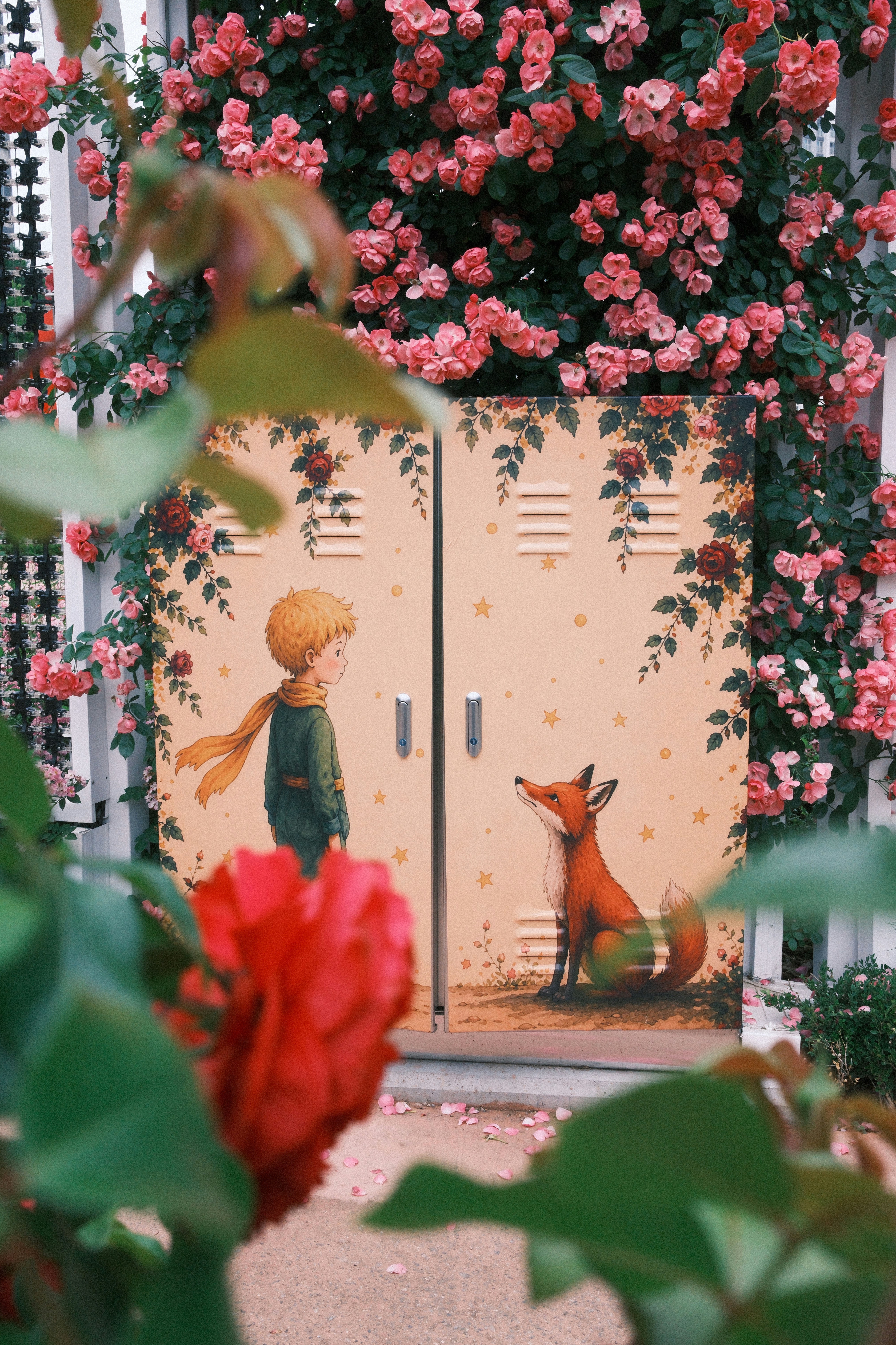 Whimsical mural guardians among blooming walls