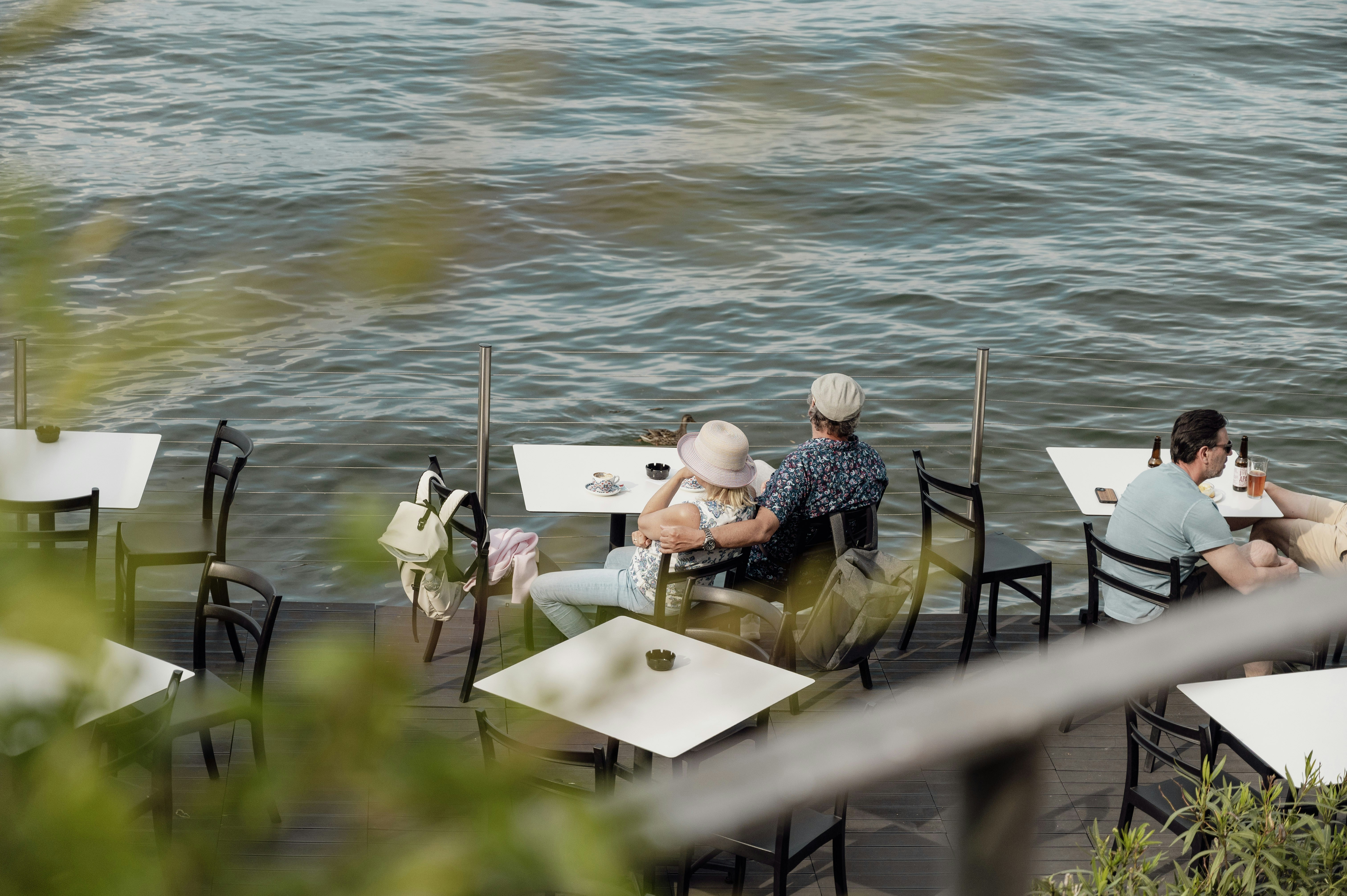 Cafe by the Water: Quiet Moment at an Outdoor Riverside Table