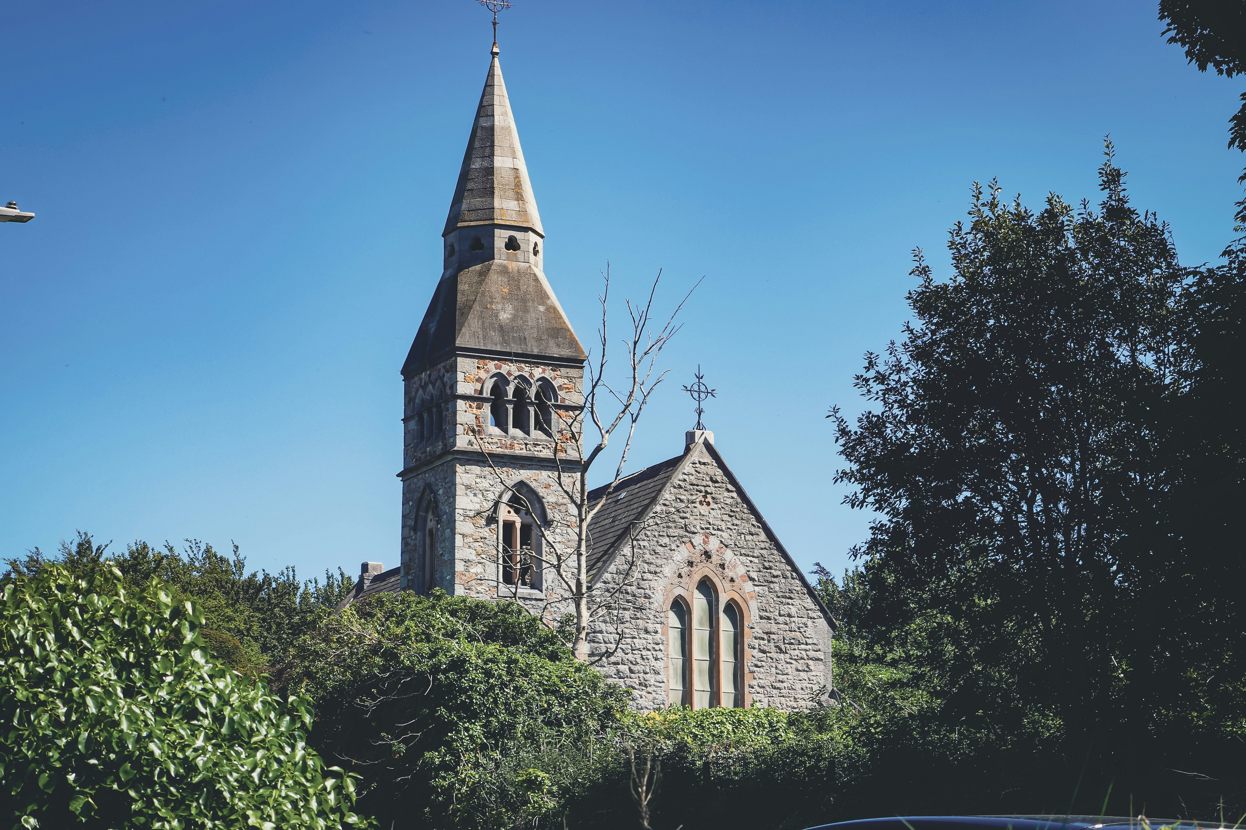 Stone Church Summit: A Spire Rising Above Verdant Frames