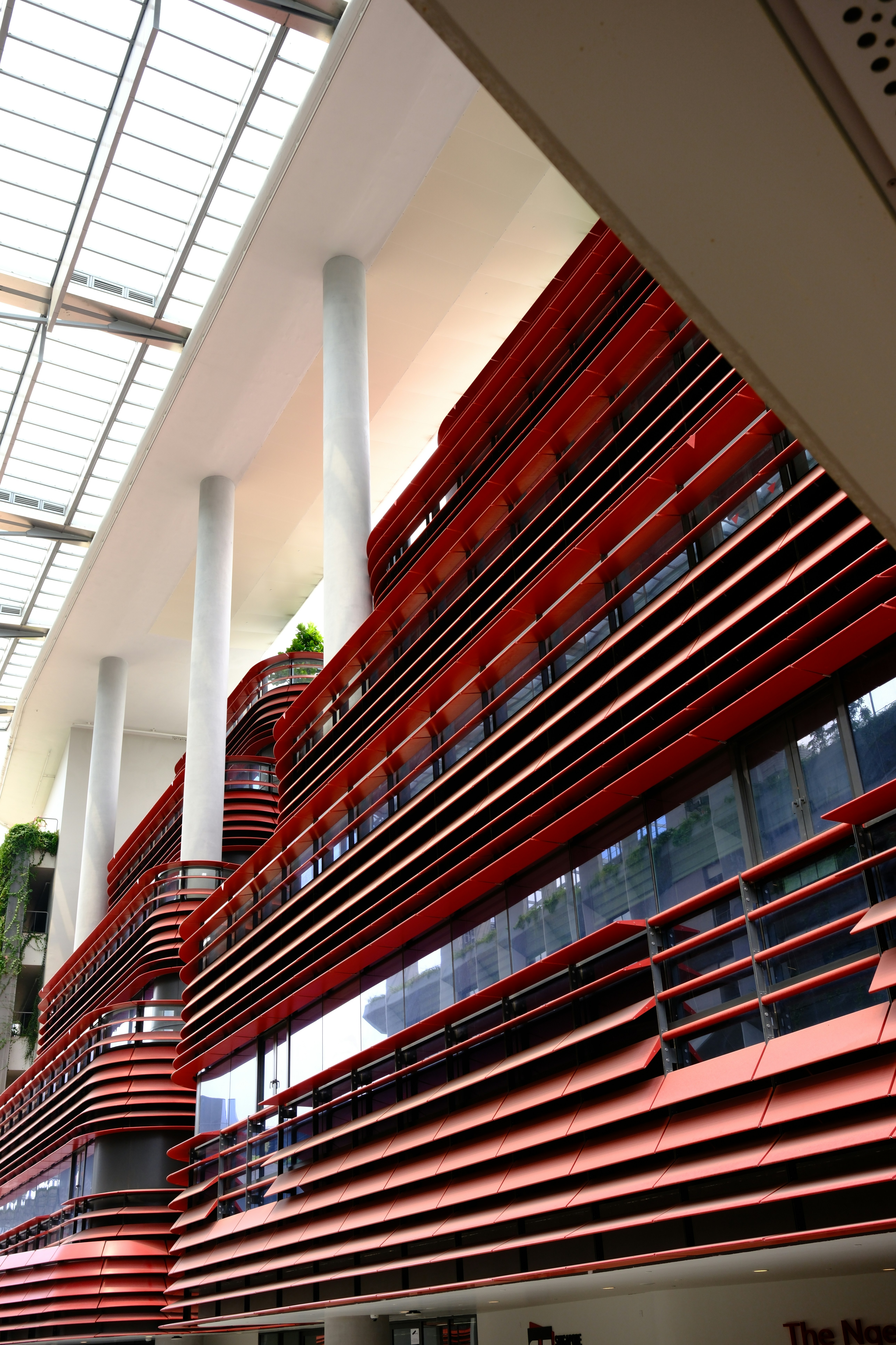 Red Slats and White Columns: A Modern Atrium's Geometry