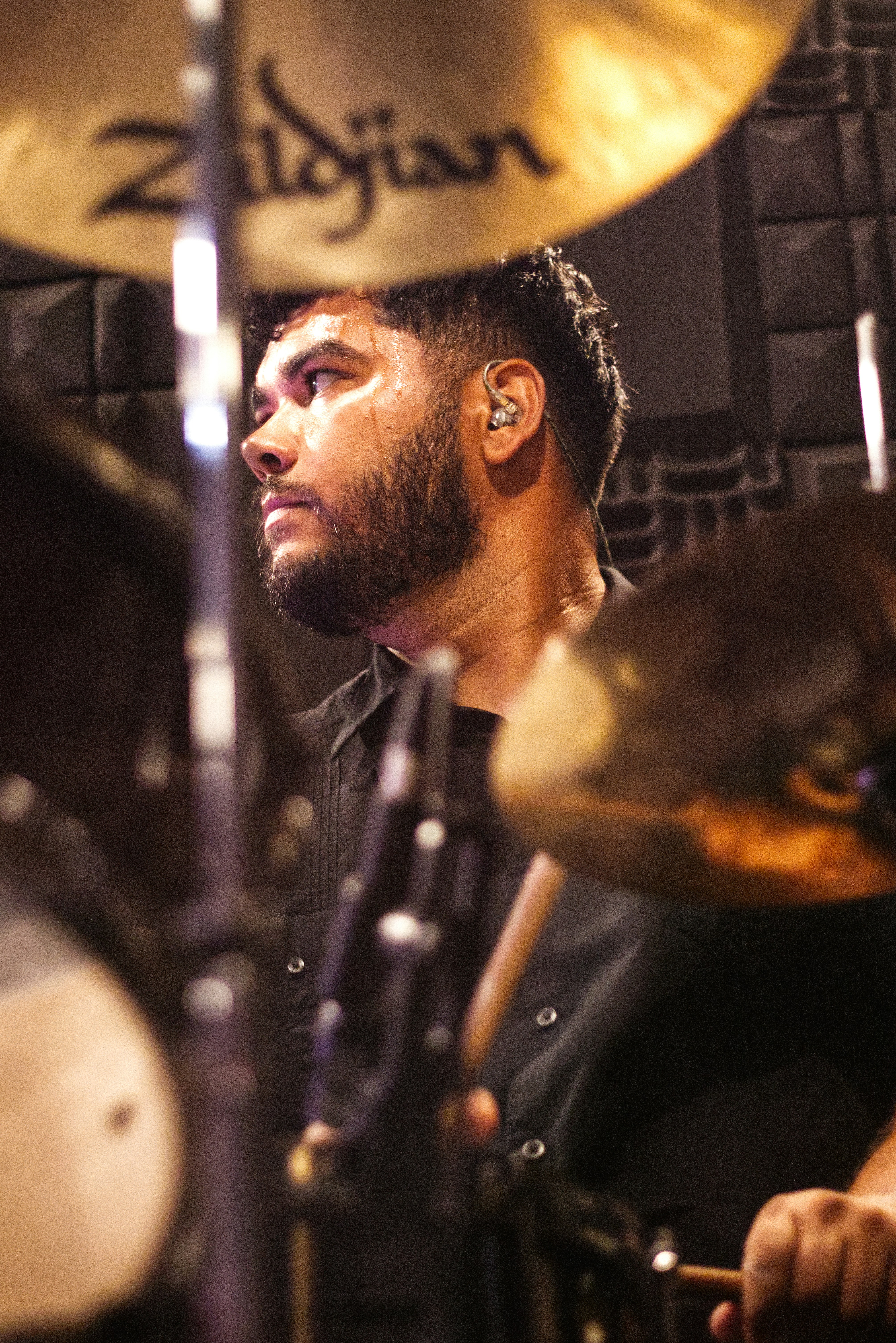 Drumline Focus: A drummer’s intense gaze through the kit's haze