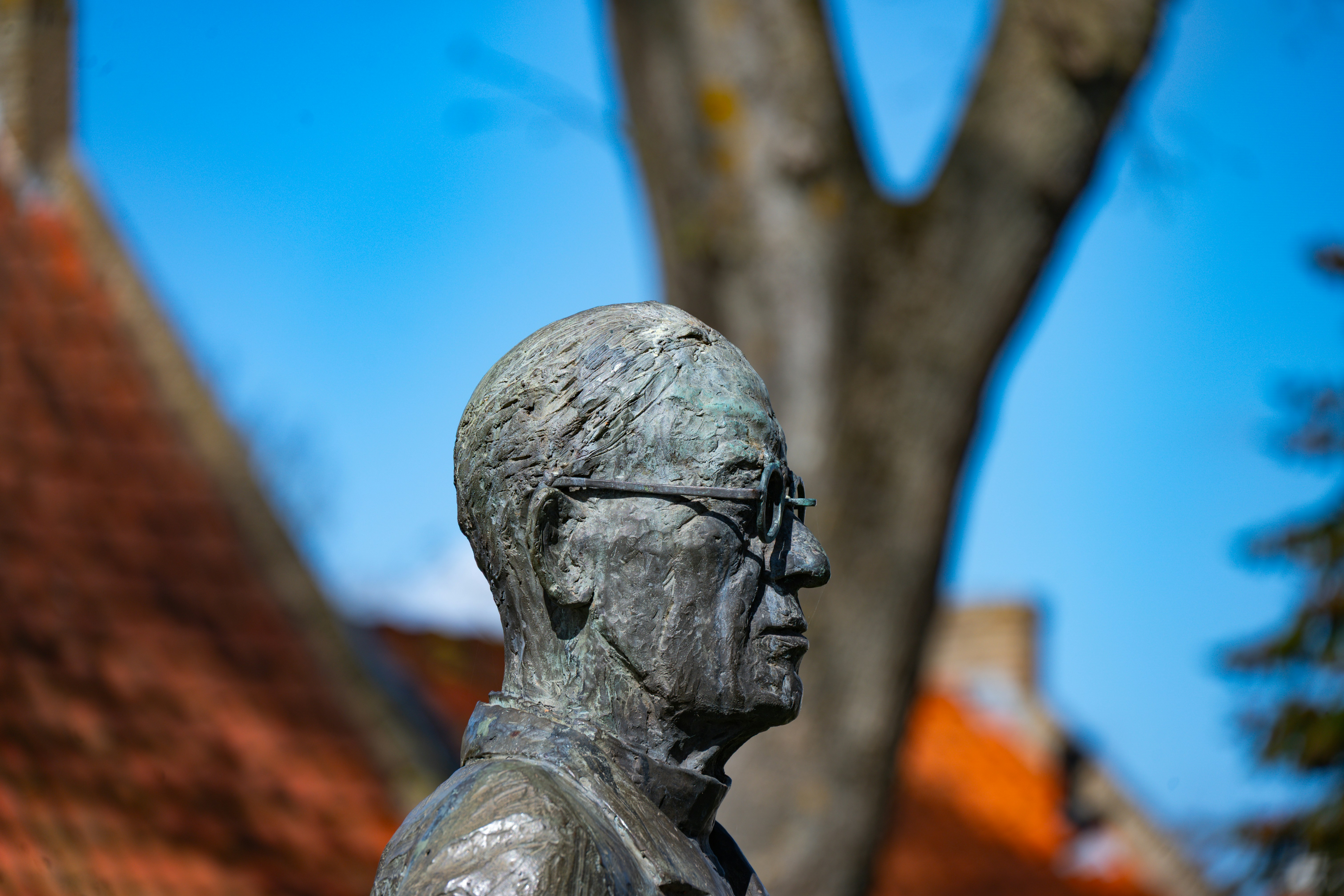 Bronze Silent Figure Under a Blue Sky