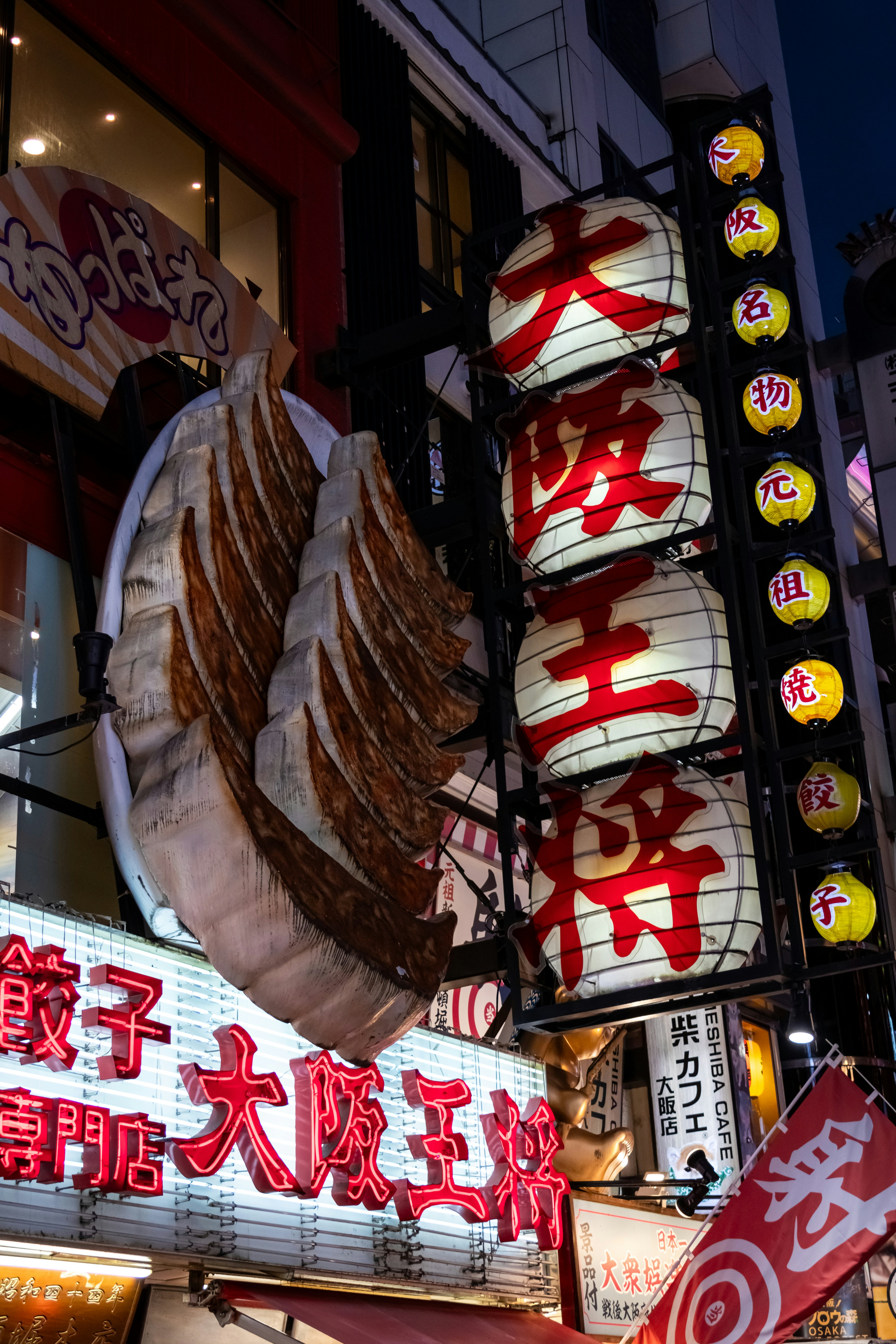 Night Neon: The Giant Rooster and Red Lanterns Tower Over Dotonbori