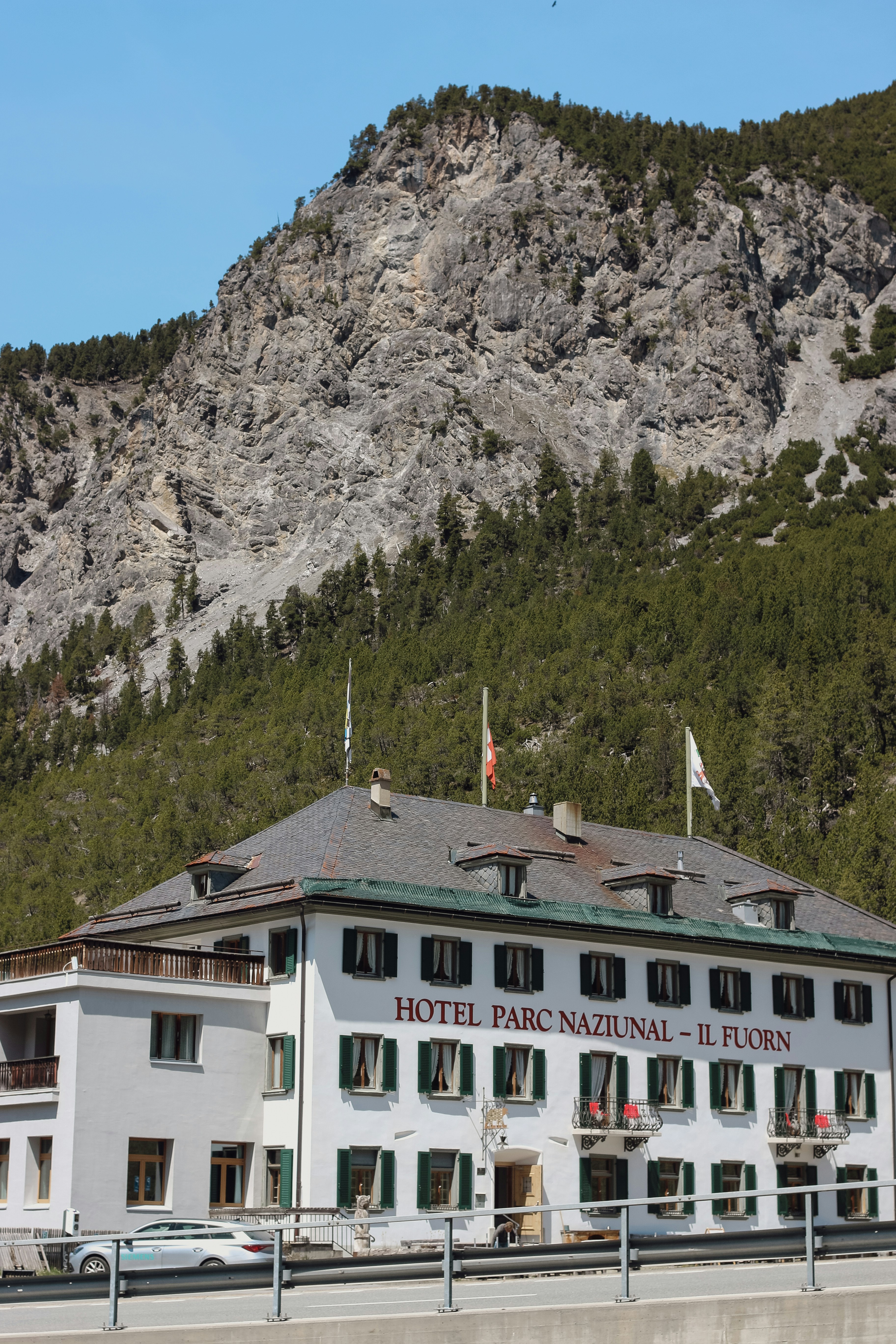 Hotel Parc Nacional at the Foot of a Rugged Alpine Cliff