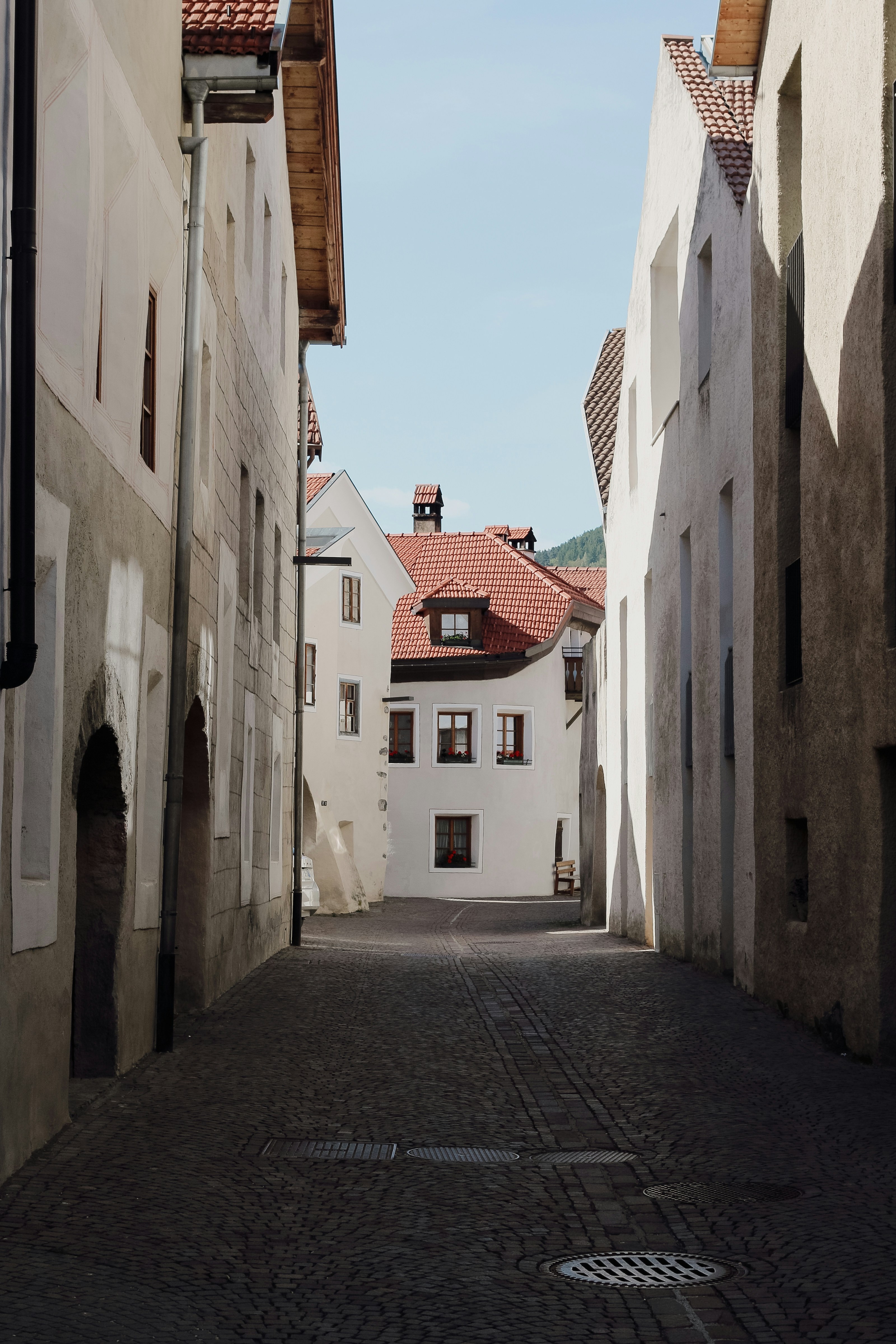Sunny Alleyway to Village Whitewashed Charm