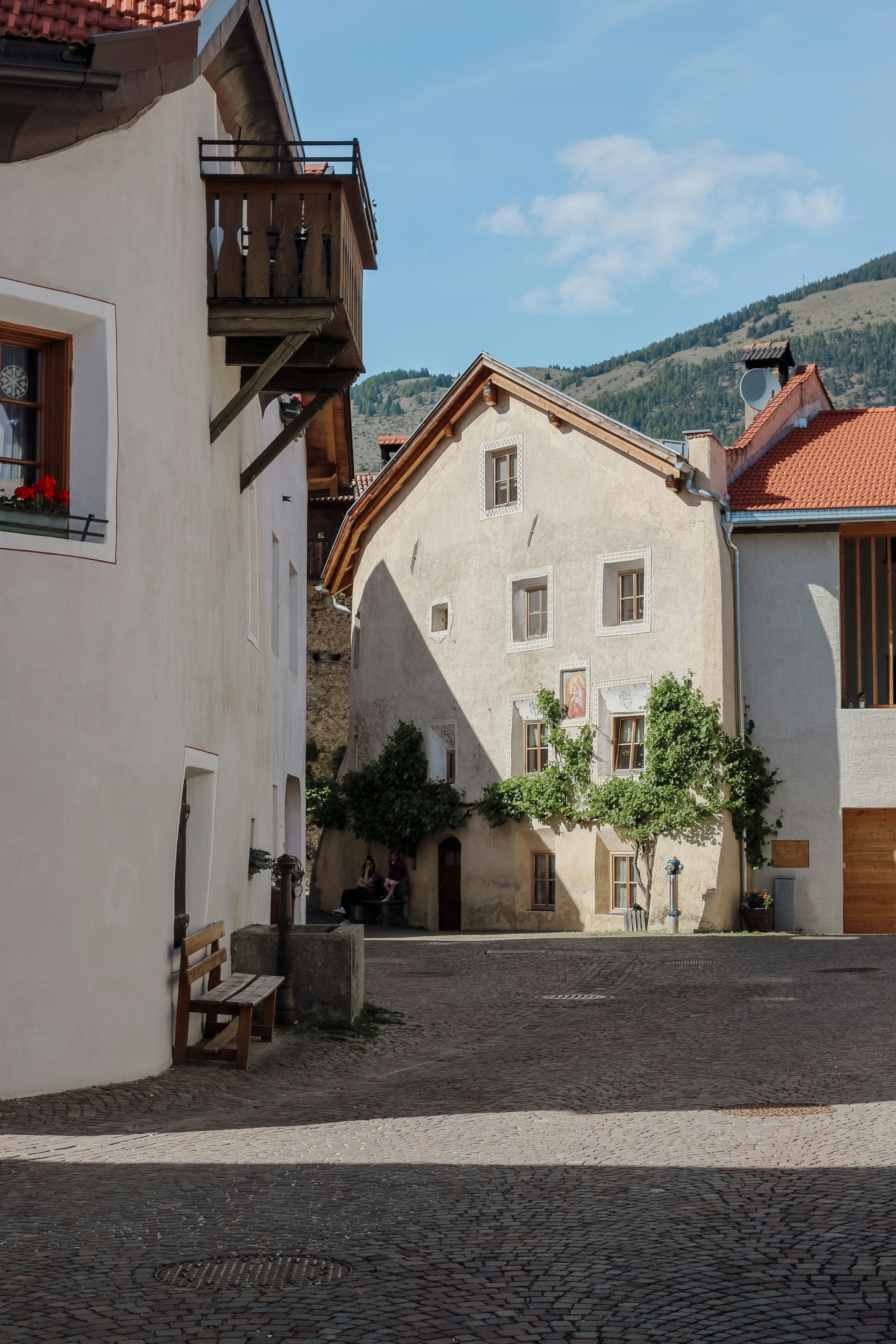 Gabled House Corridor: A Quiet European Street Between Stone and Sky