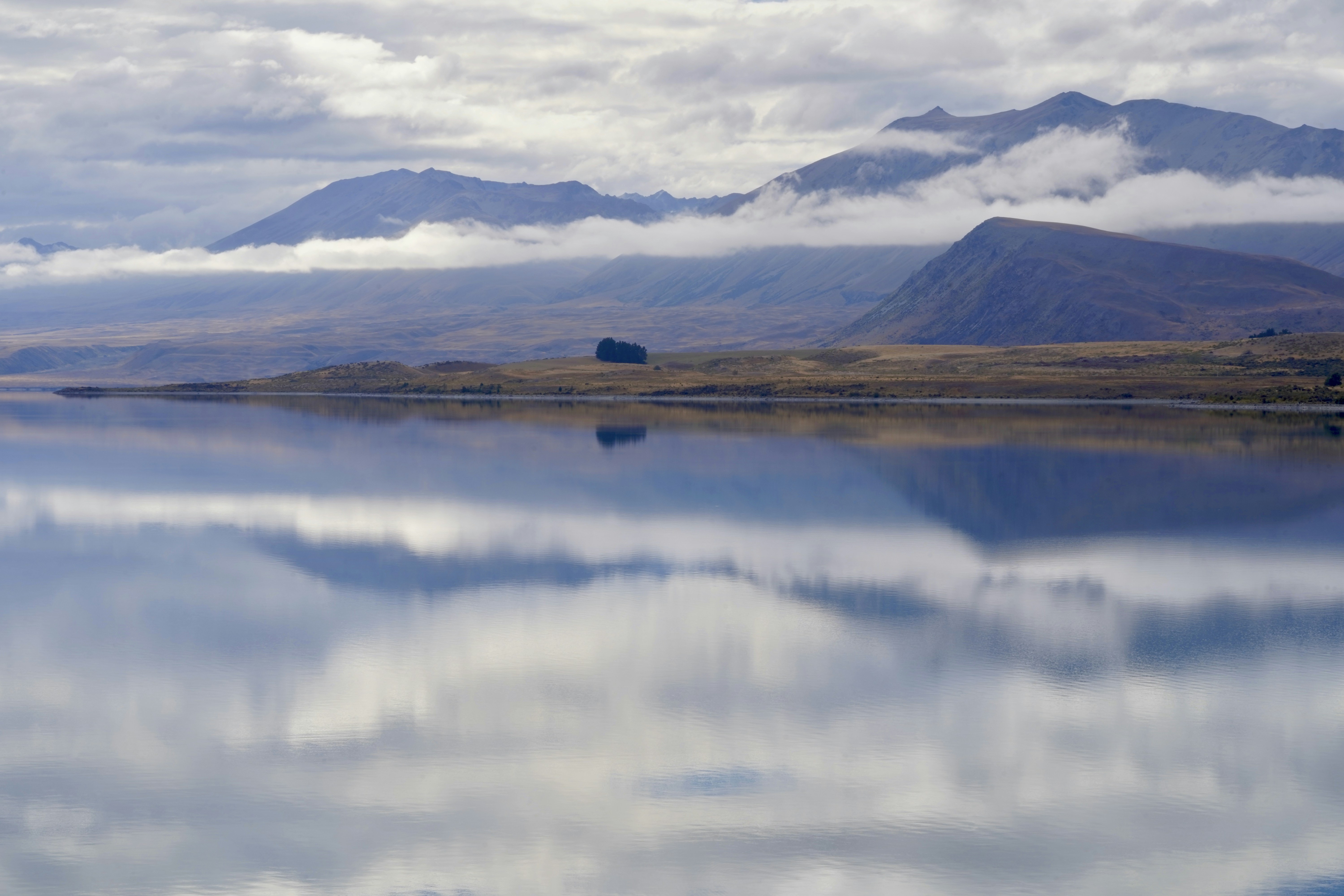 Mirror Line over Quiet Expanse: Mountain Ridge Reflected