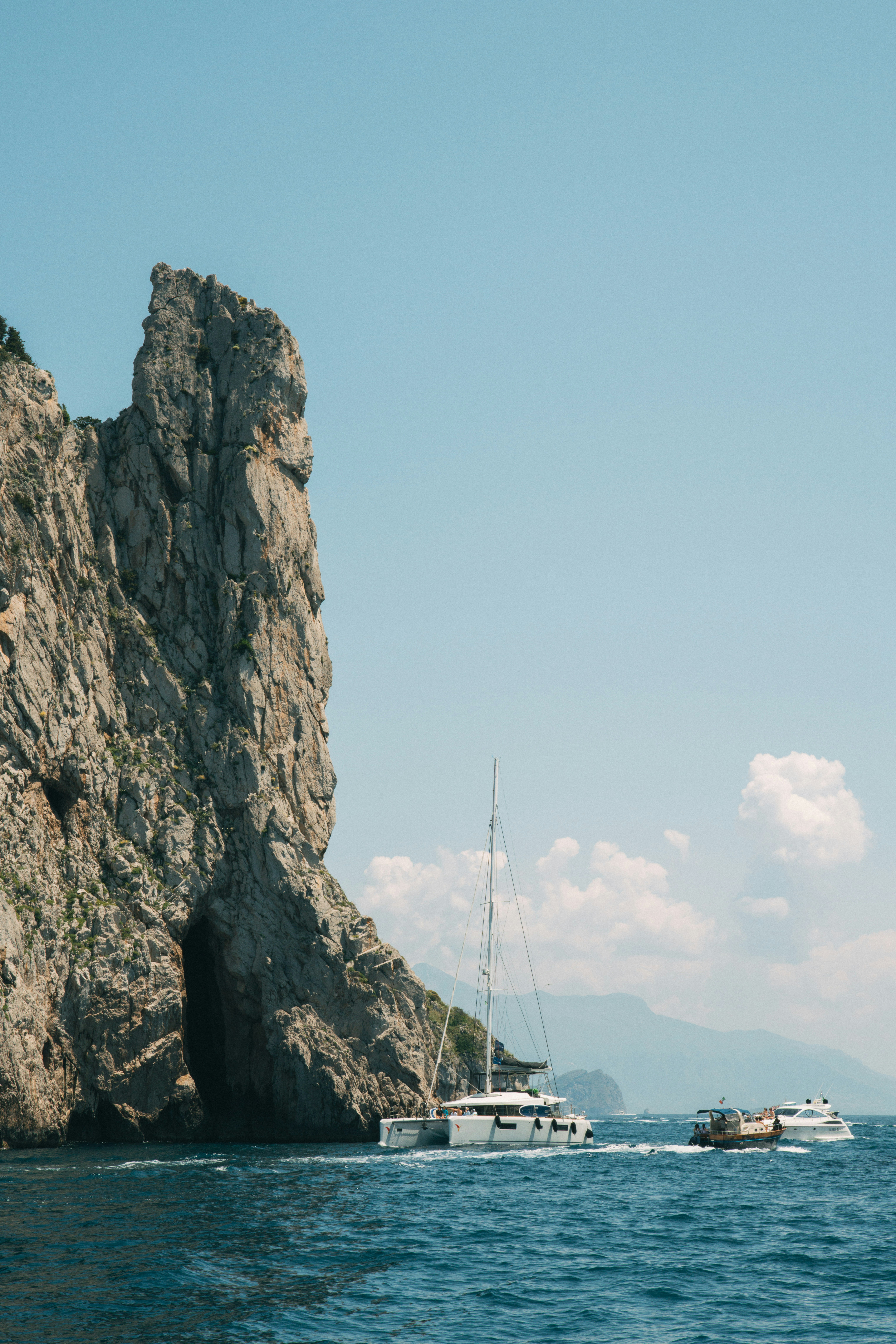 Sharp Rock Promenade: Boats at the Base of a Sea-Cliff
