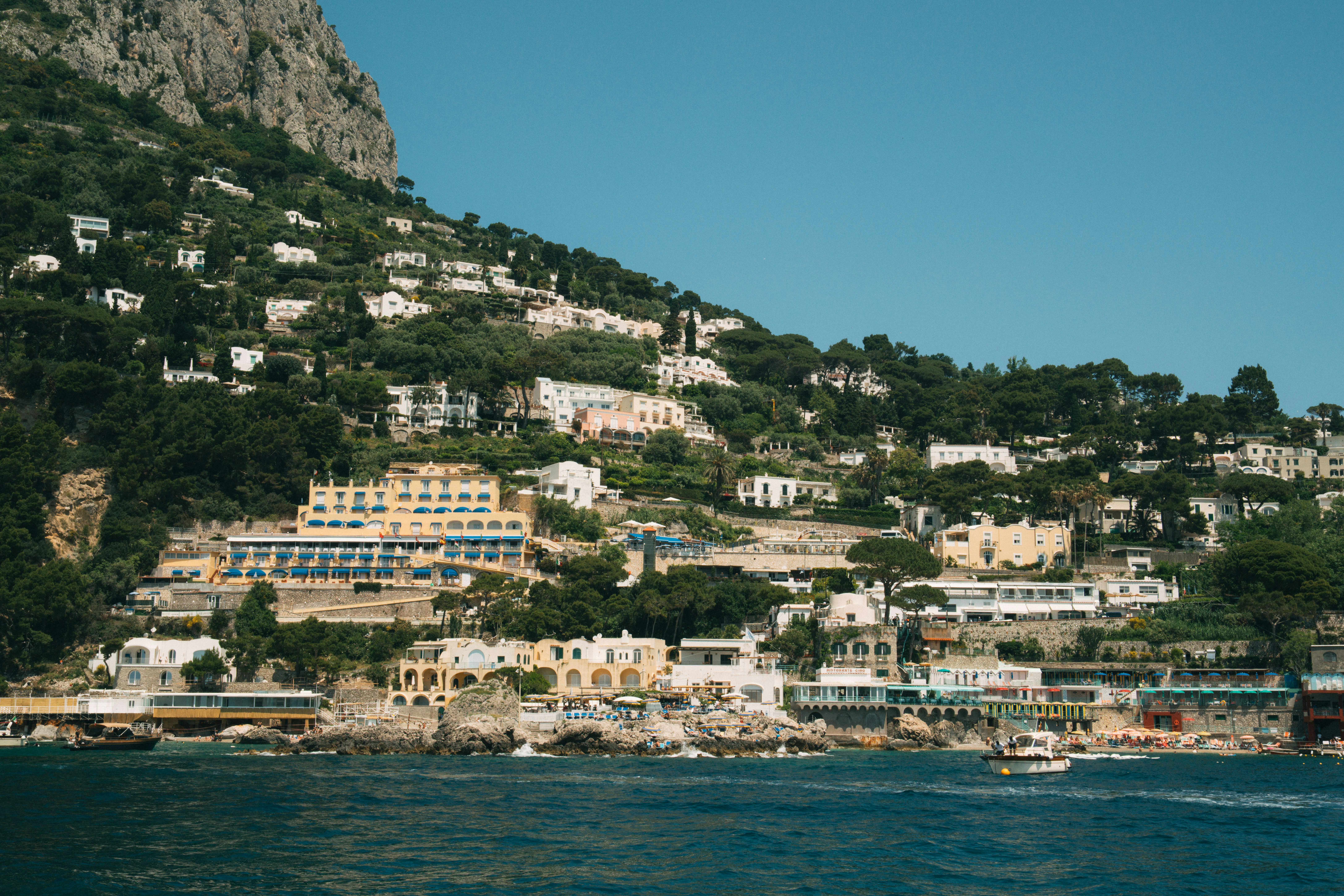 Coastal Village Terrace Faces the Sea Under a Clear Blue Sky