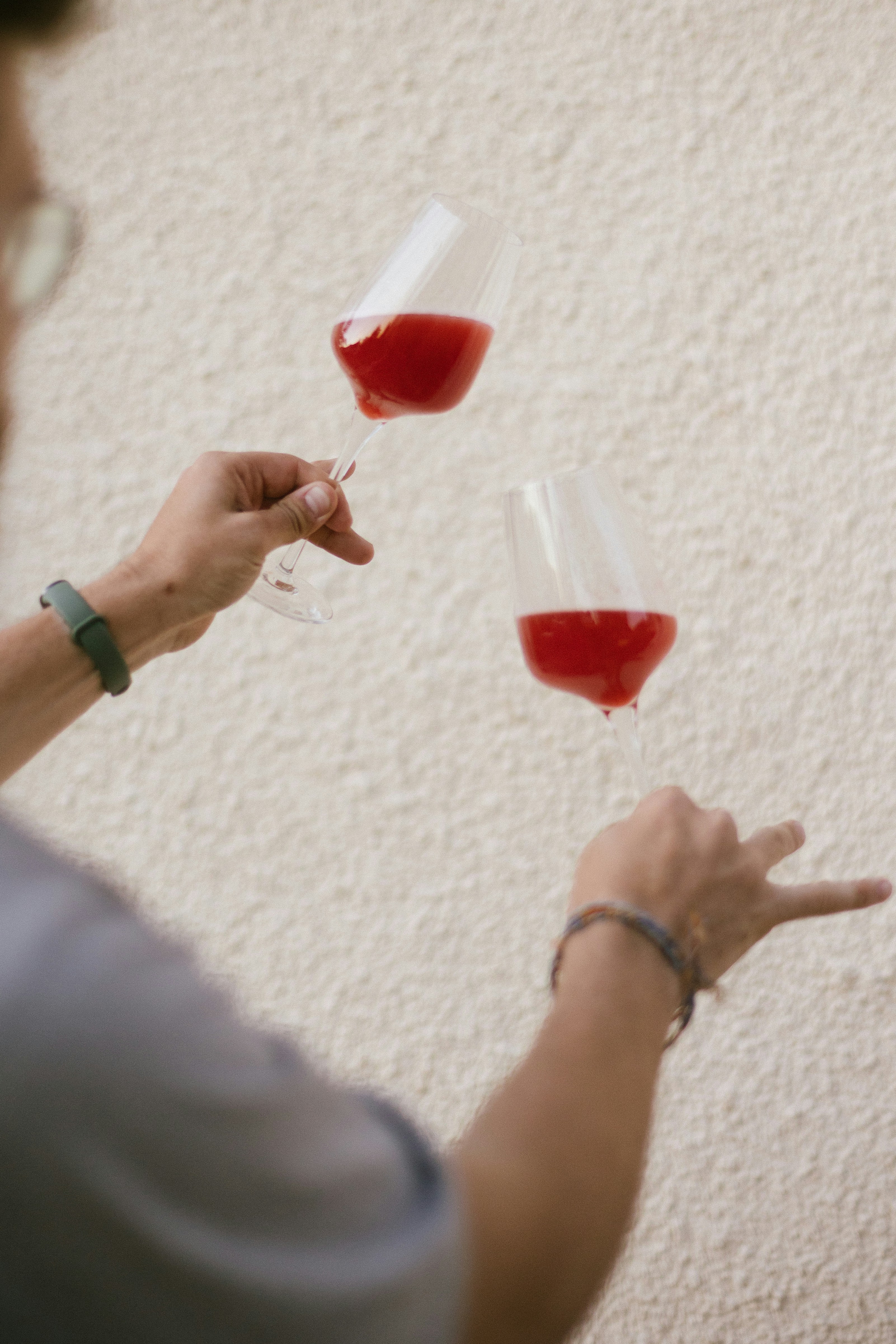 Toasting Red: A Quiet Moment of Shared Glasses
