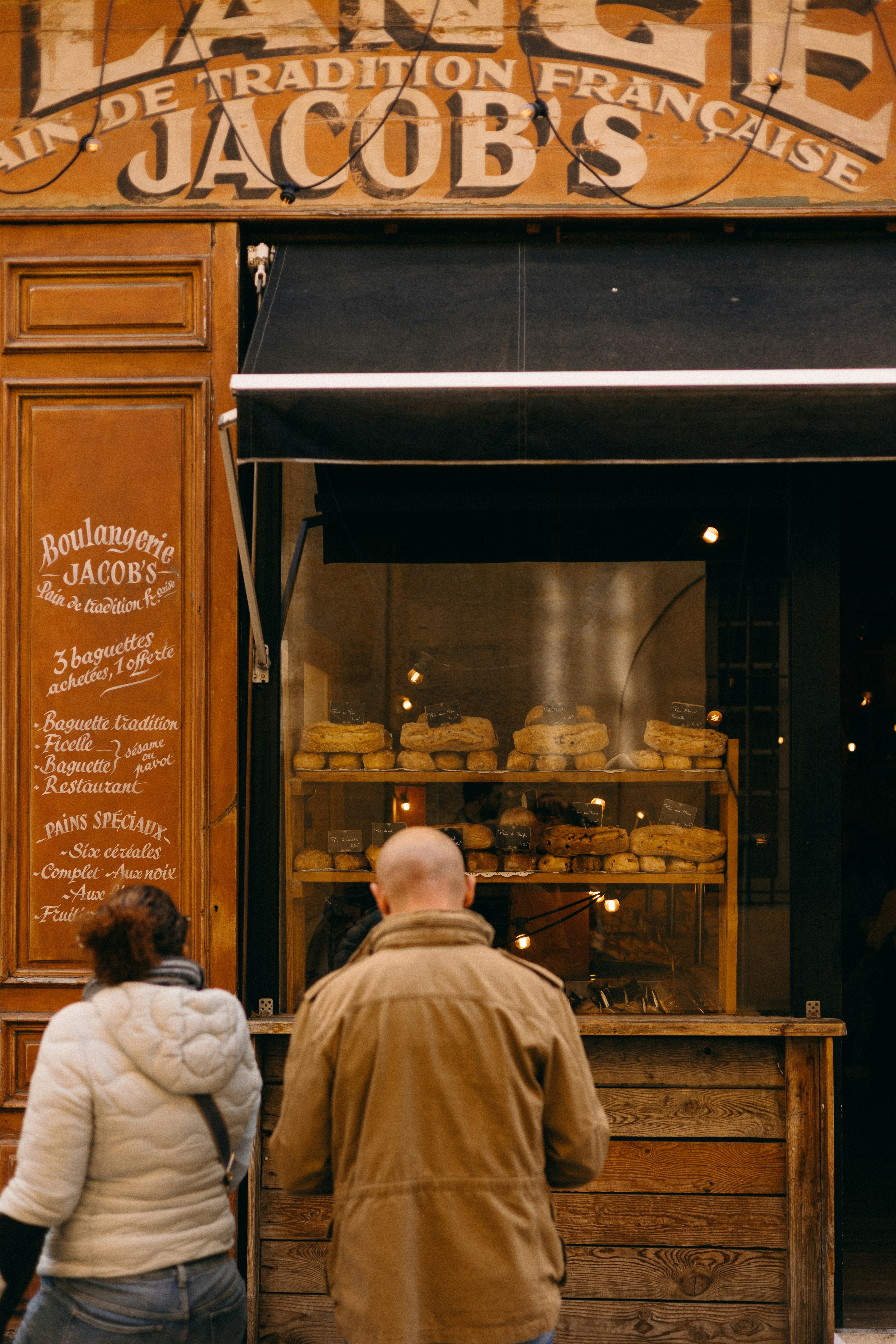 Warm Bakery Window: Baguettes and Street View