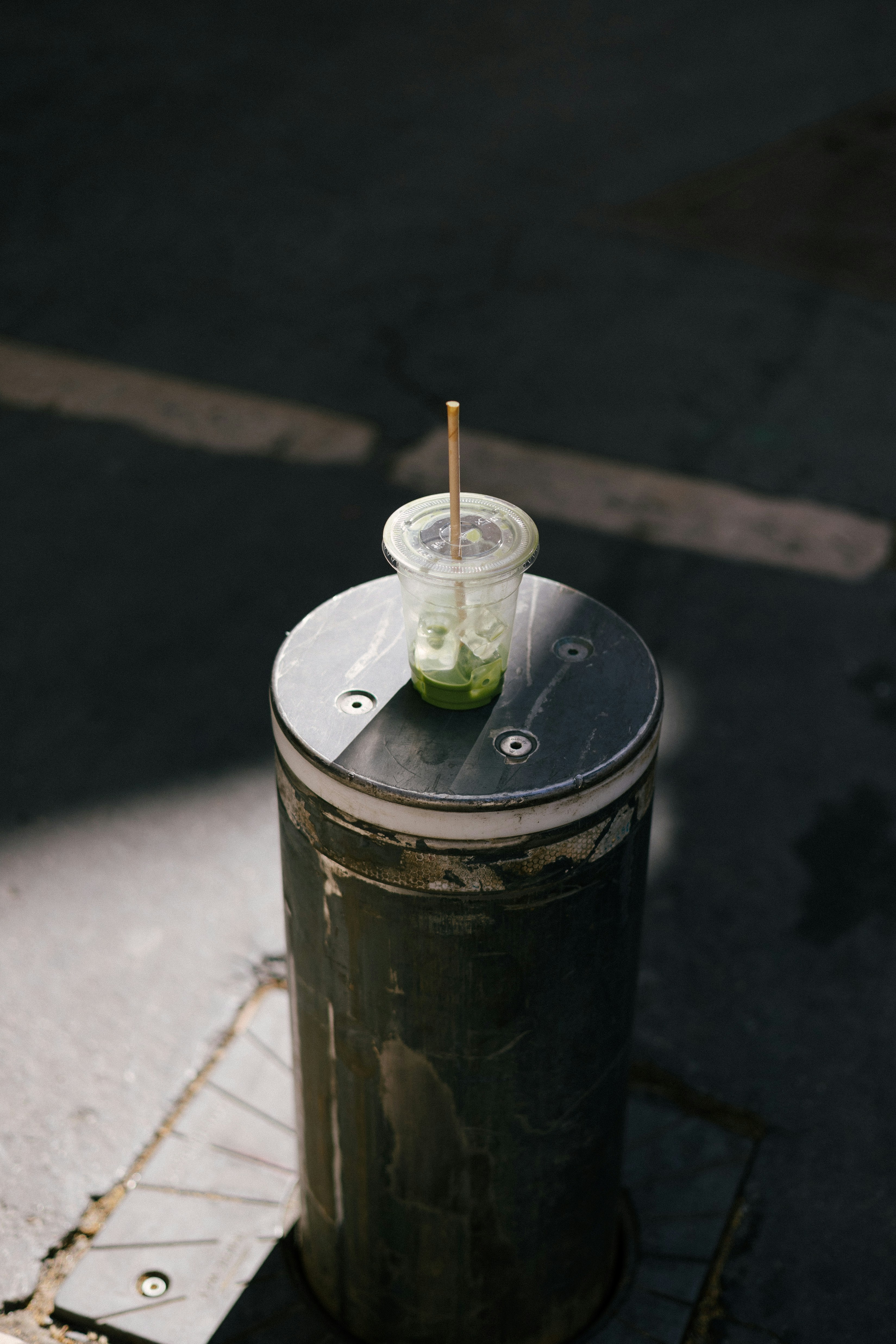 Green Sip on a Metallic Post