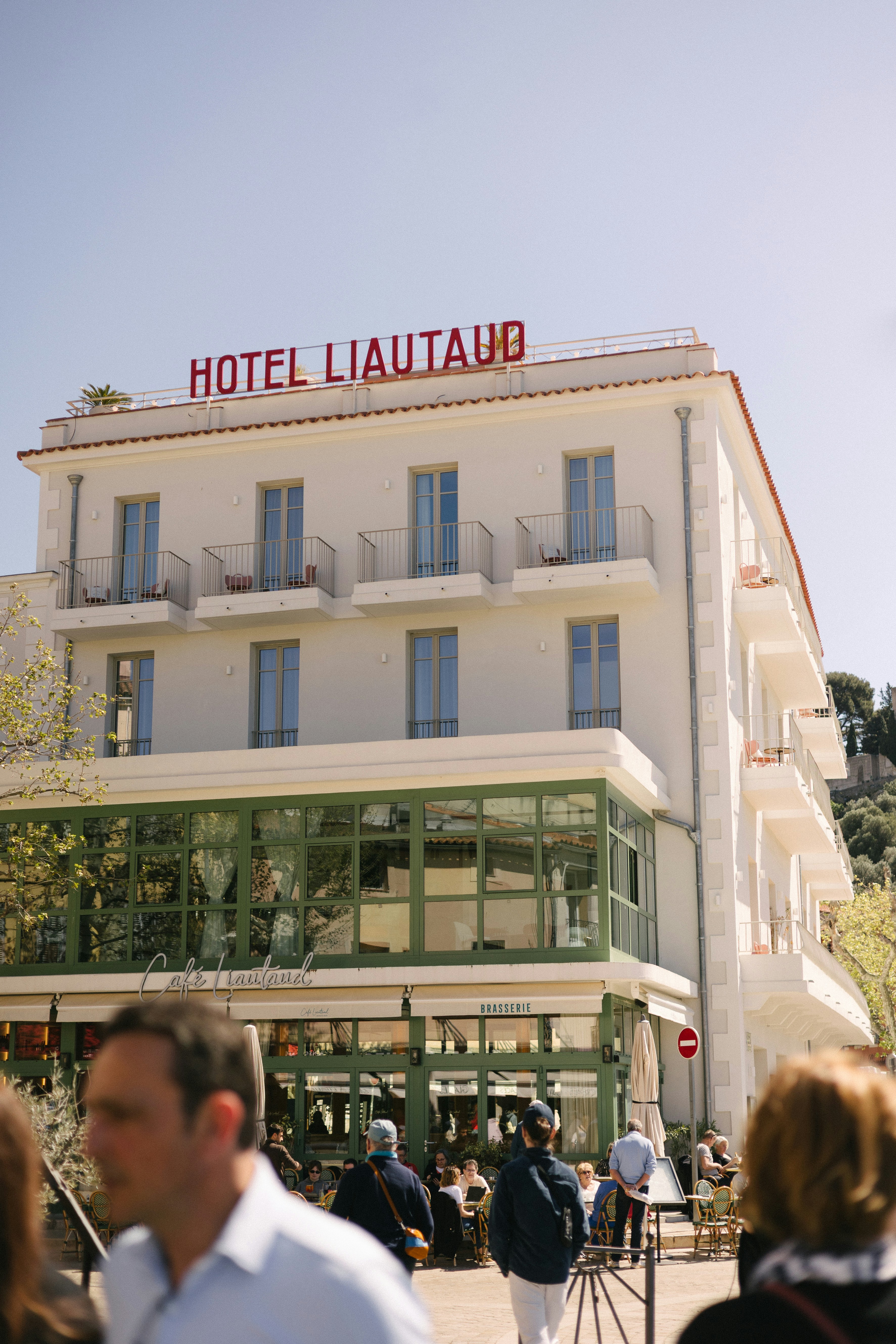 Hotel LIAUTAUD in Sunlit Frond: Balcony Facades and Cafe Front
