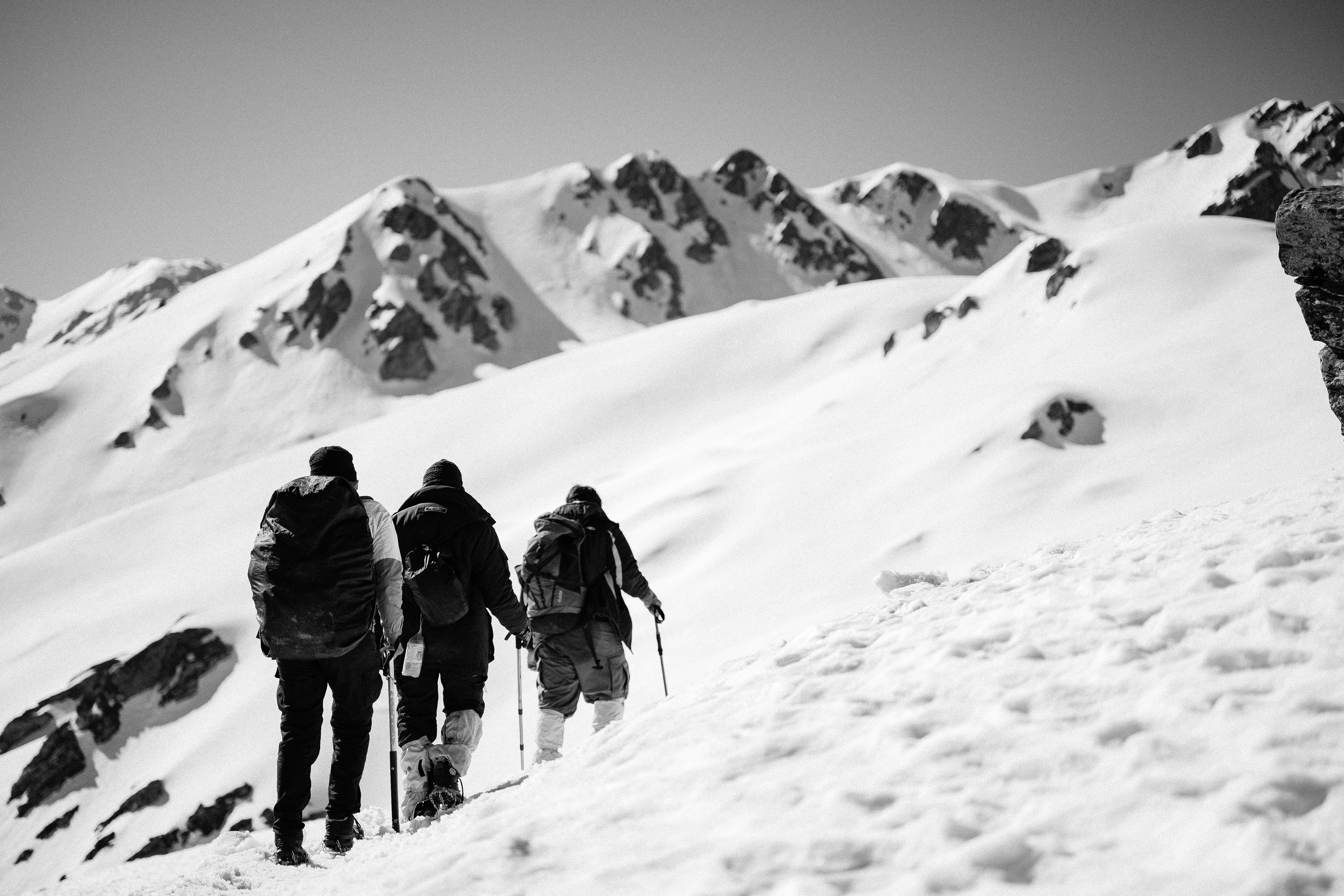 Triad Ascent: Snowbound Trek Across a Ridge
