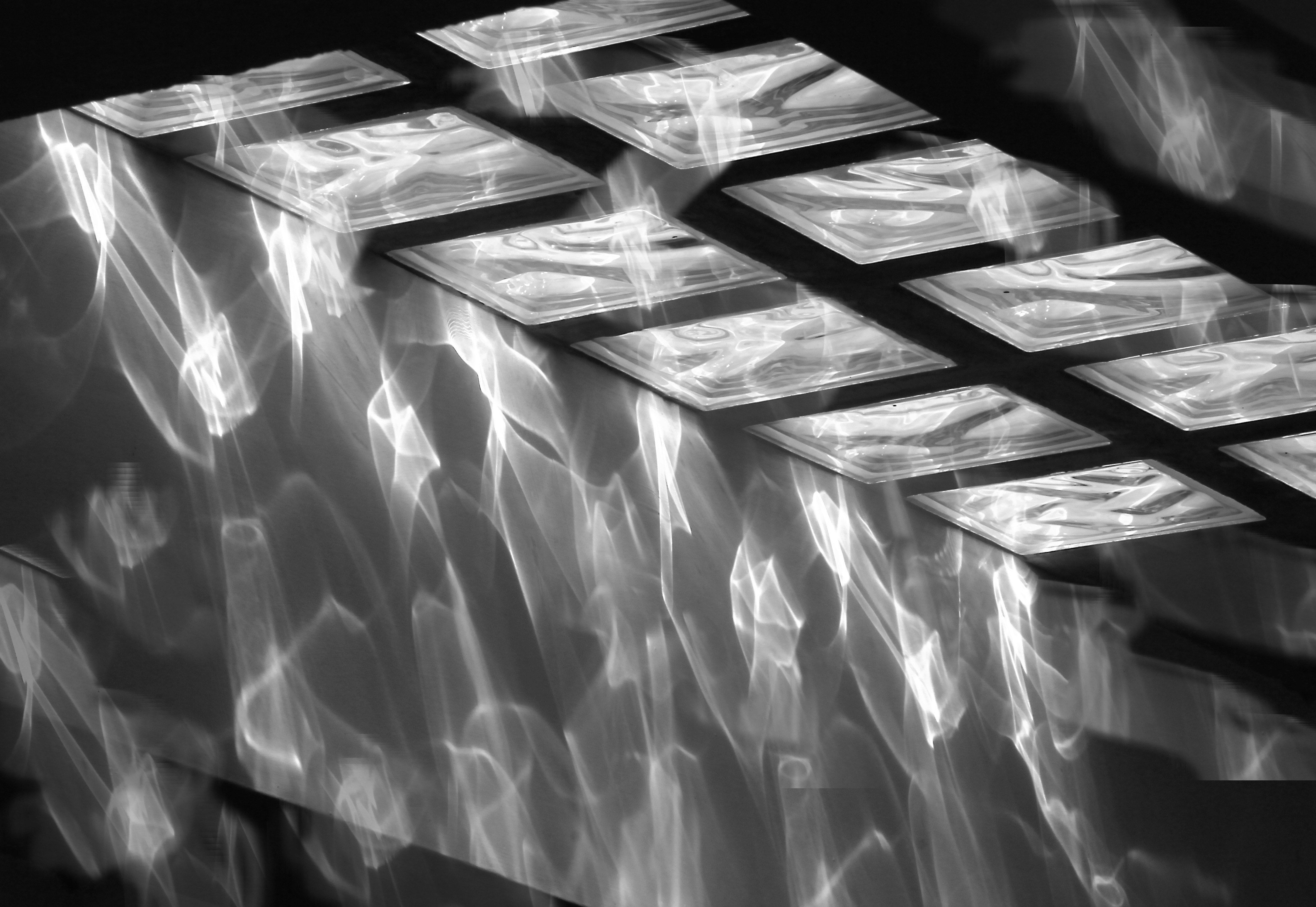 Glinting Panels: Reflections Dancing Across a Black and White Facade