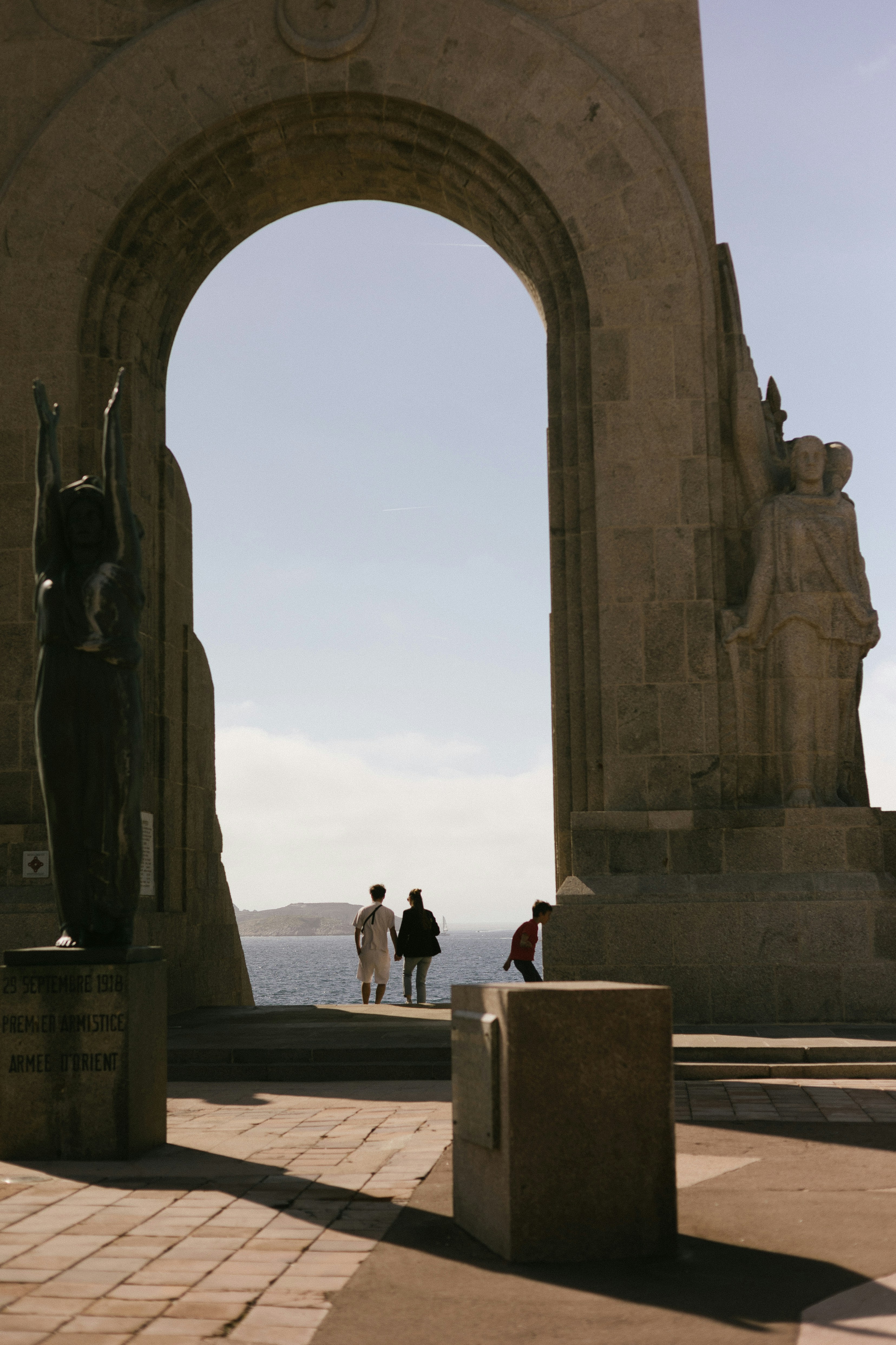 Horizon Gate: People at the Arch Framed by Stone Sculptures