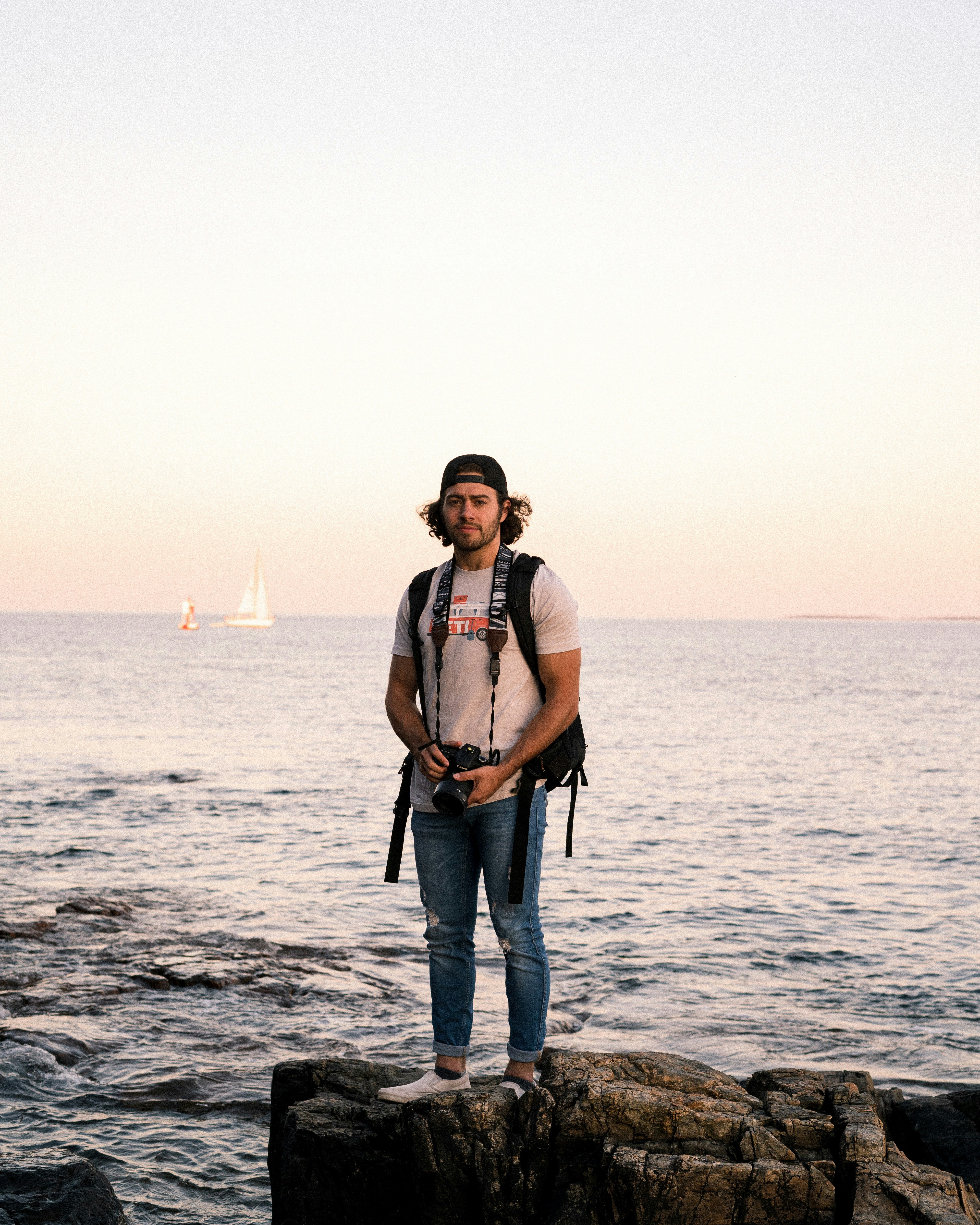 Coastal Wanderer: A Quiet Moment on the Rocks
