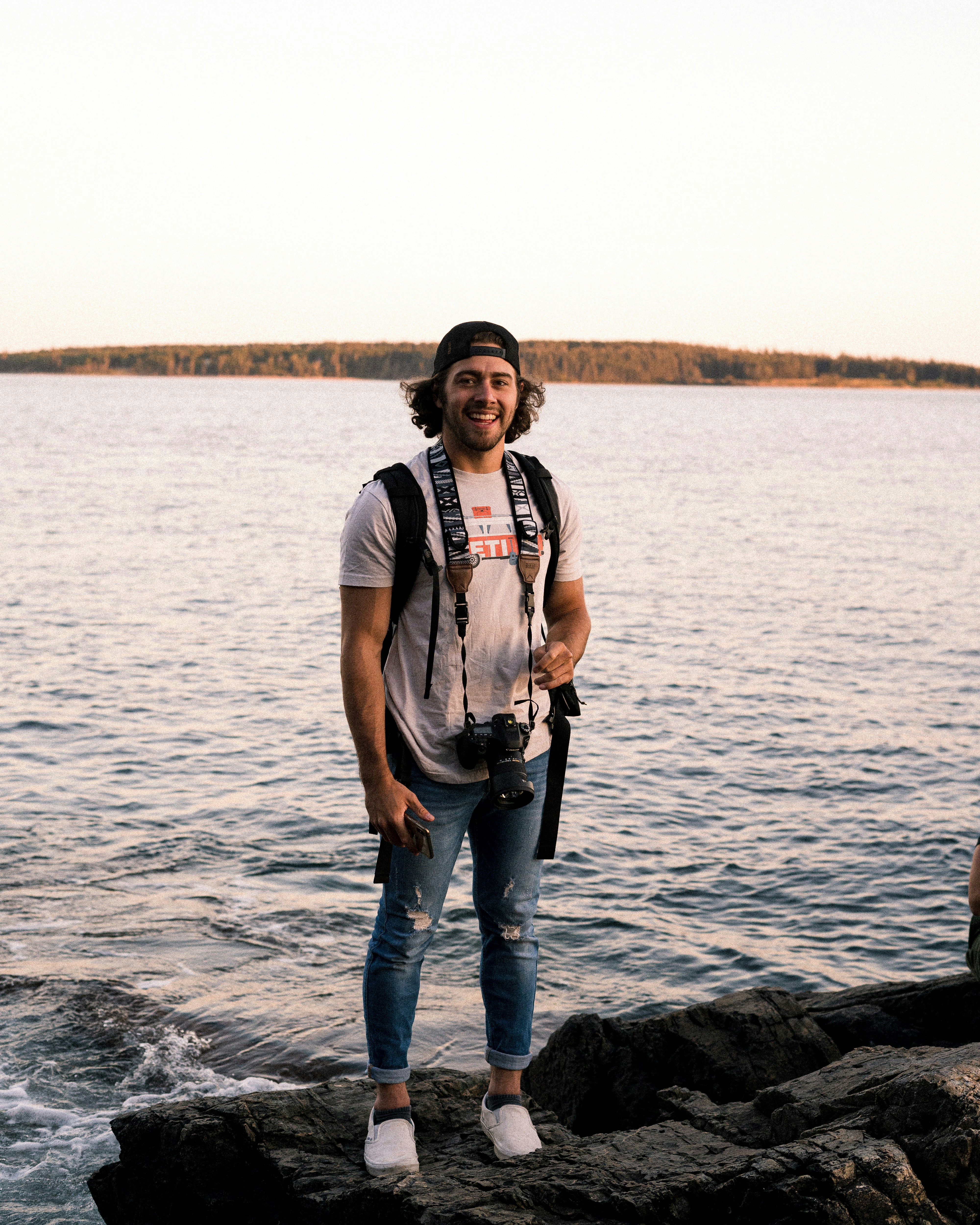 Portrait by the Shore: Adventure Photographer at Dusk