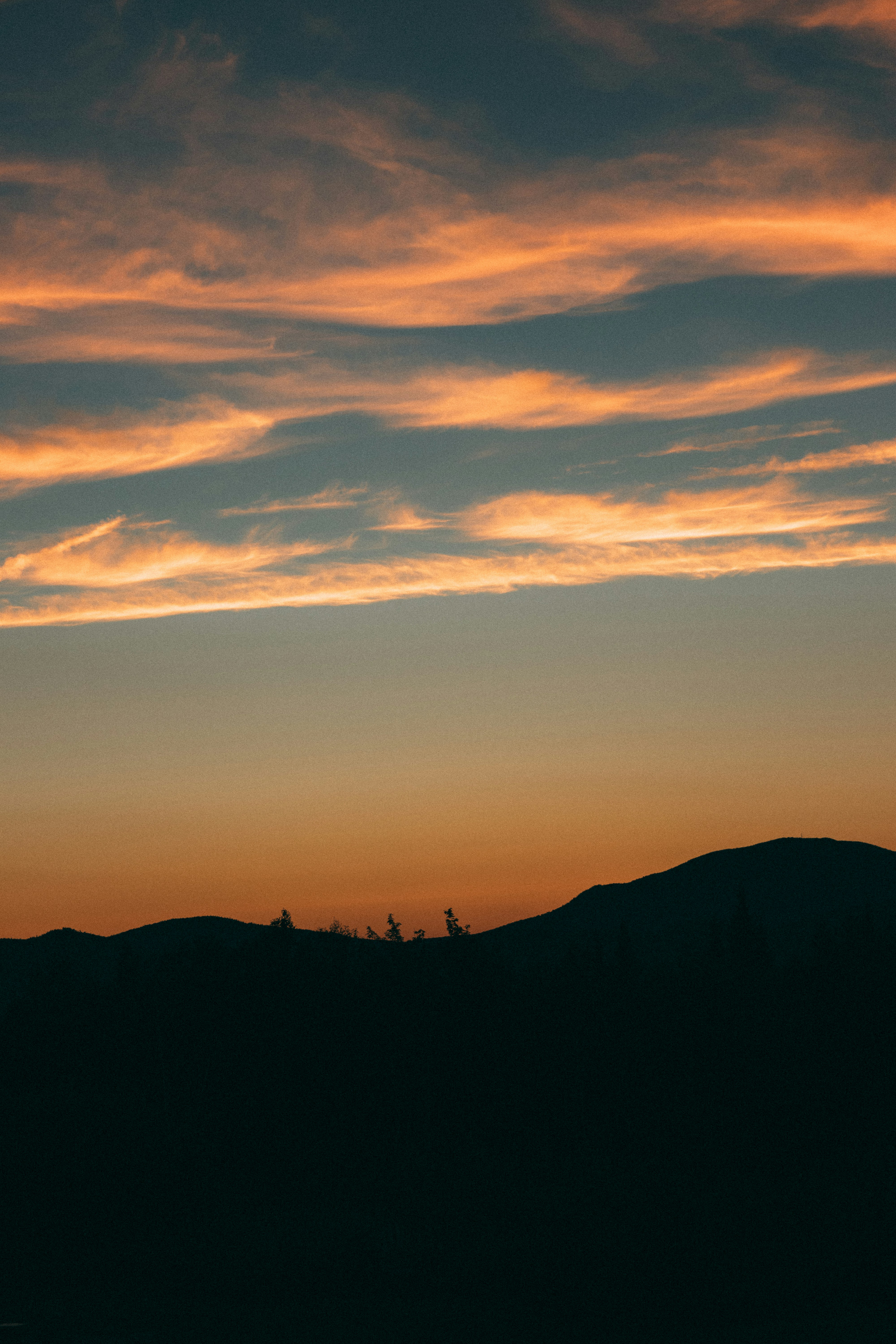 Dusk Over the Ridge: A Quiet Horizon Painted in Sunset Hues