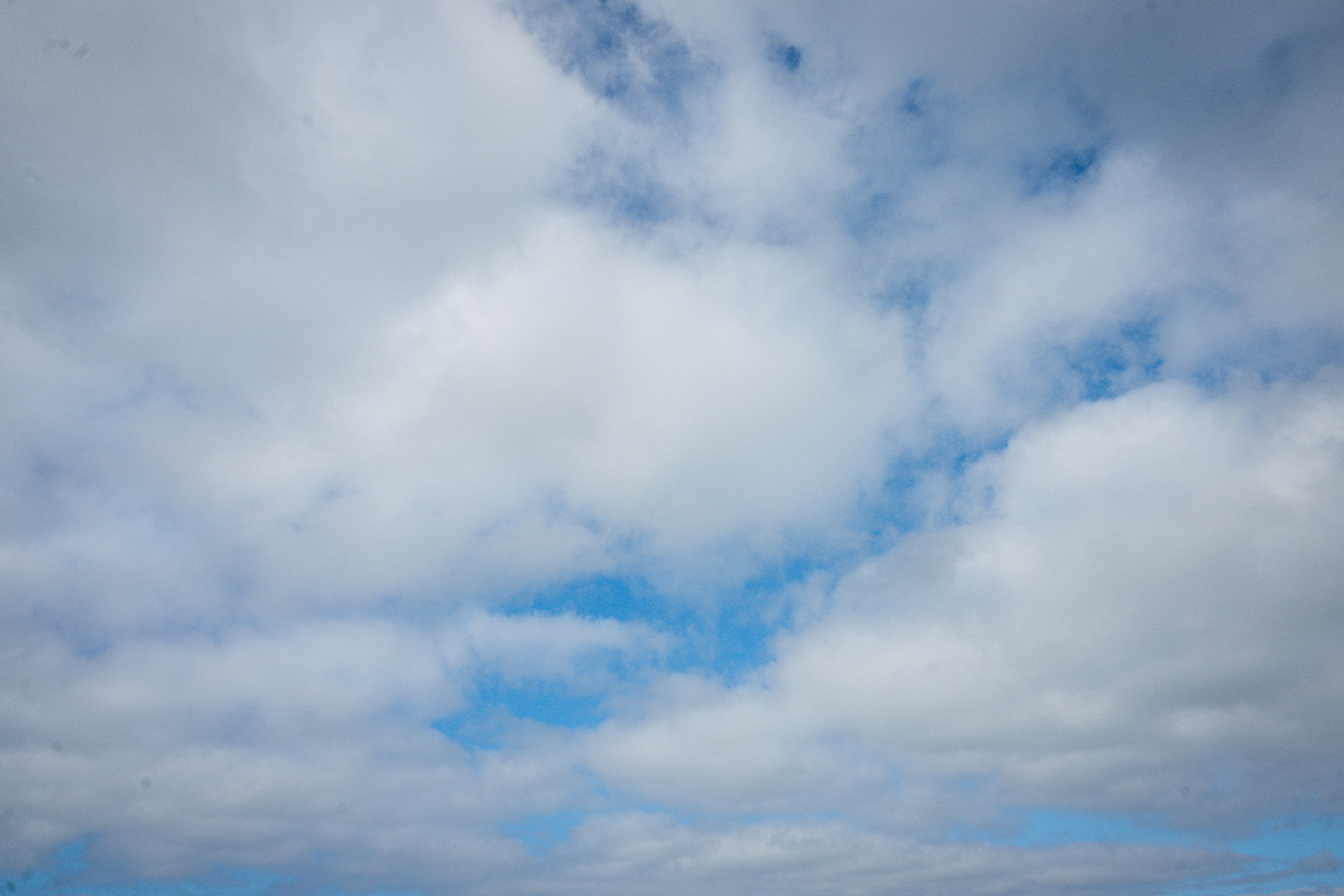 Patchwork Sky: Soft Clouds and a Hint of Blue