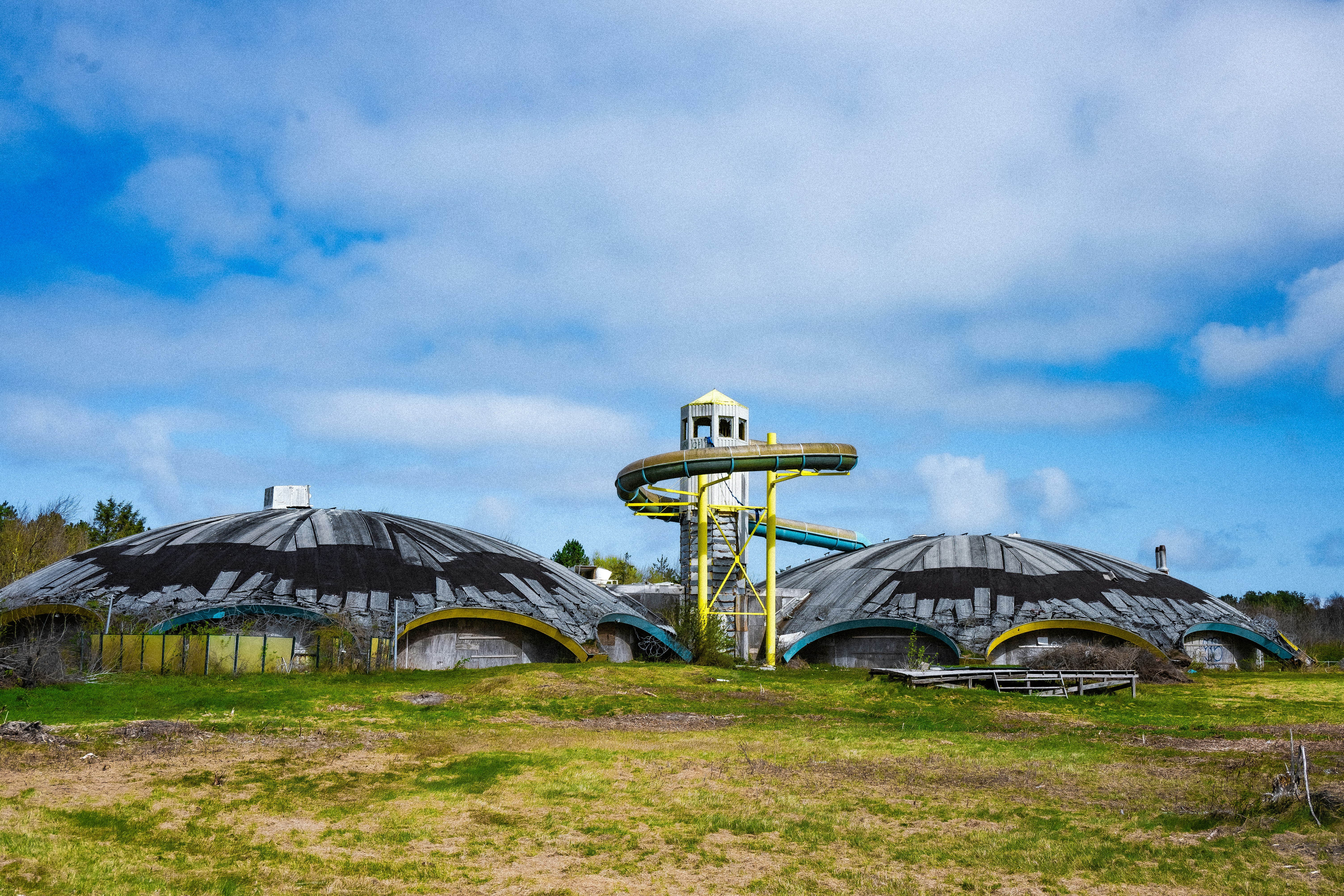 Industrial playground: a sunlit dome village under a bright sky