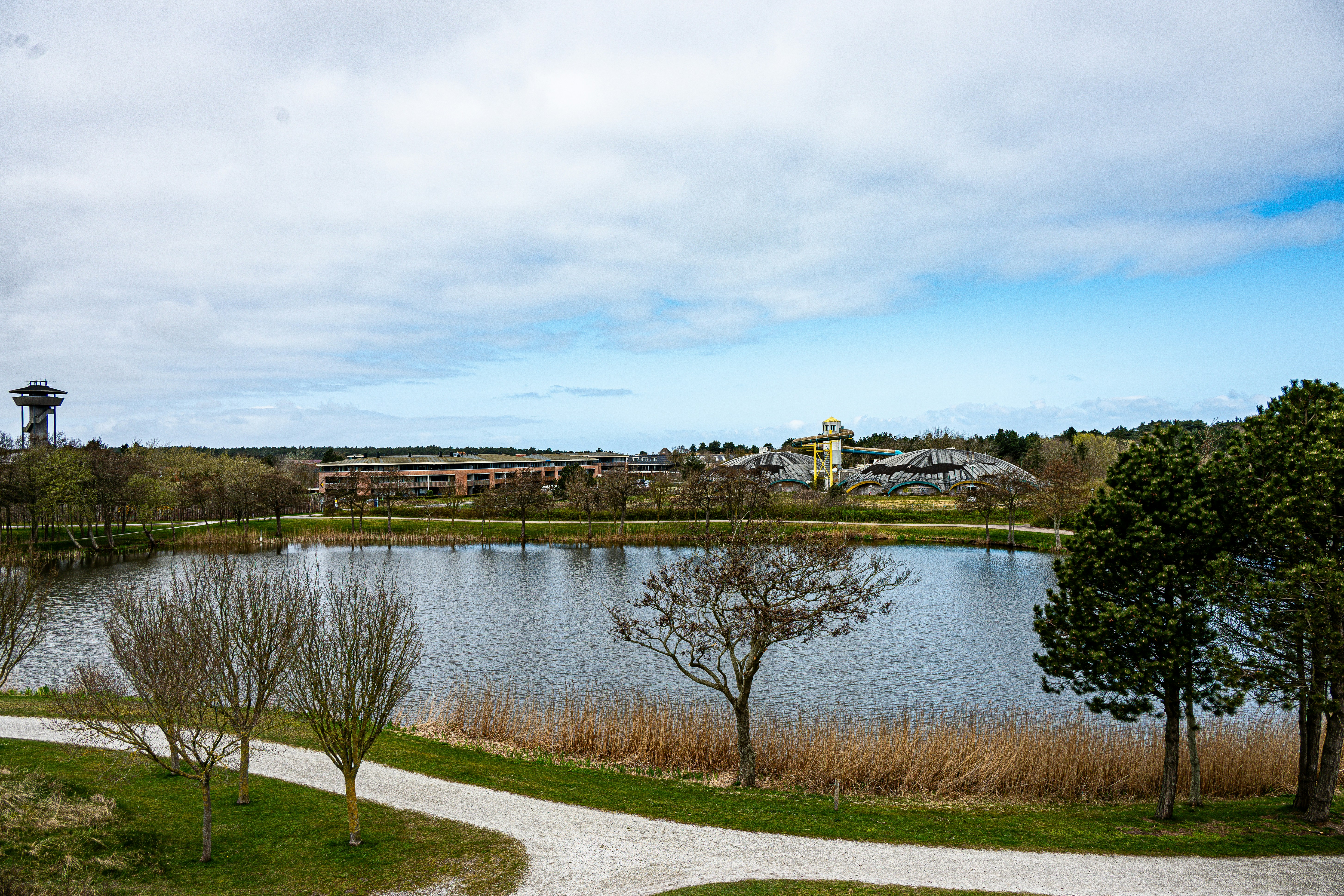 Tranquil Lake with Riverside Walk and Industrial Arc