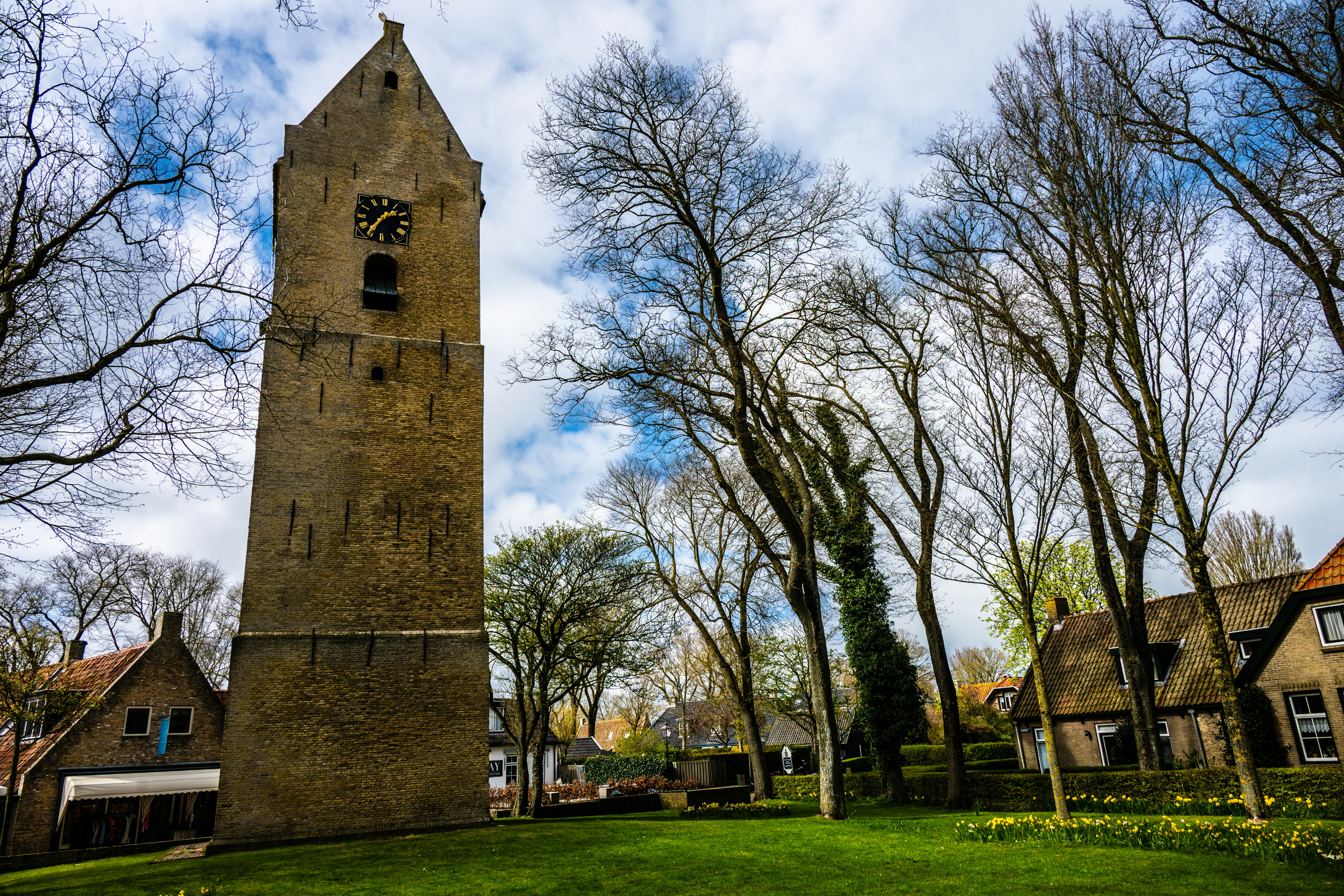 Ancient Clock Tower Rising Over a Quiet Village Square