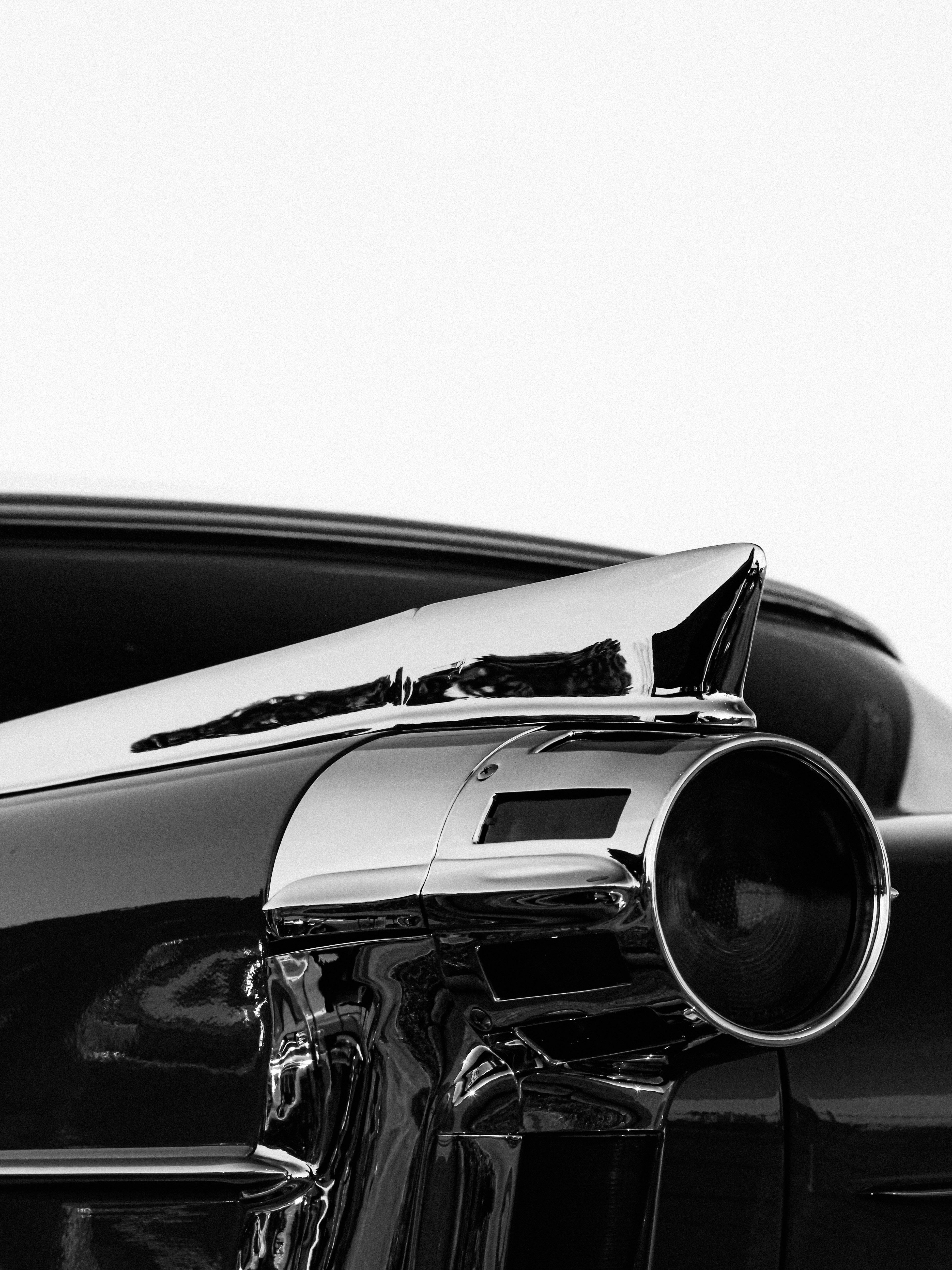 Chrome Crown: The finned tailfin of a vintage car
